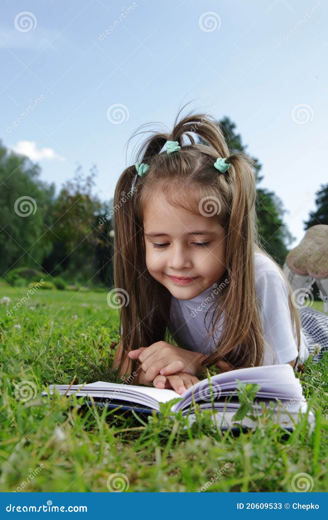 Girl read book on grass stock image. Image of relaxed - 20609533