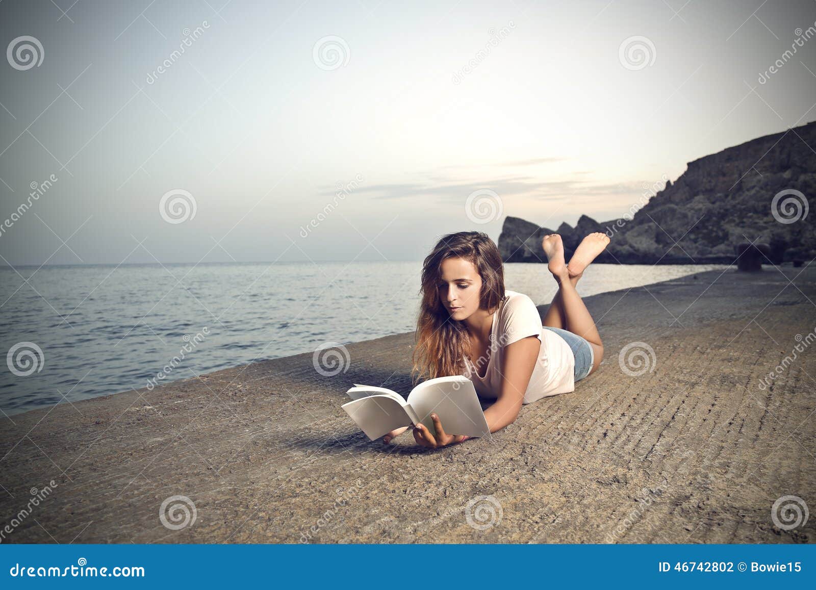 Girl reading at the beach stock photo. Image of landscaped - 46742802