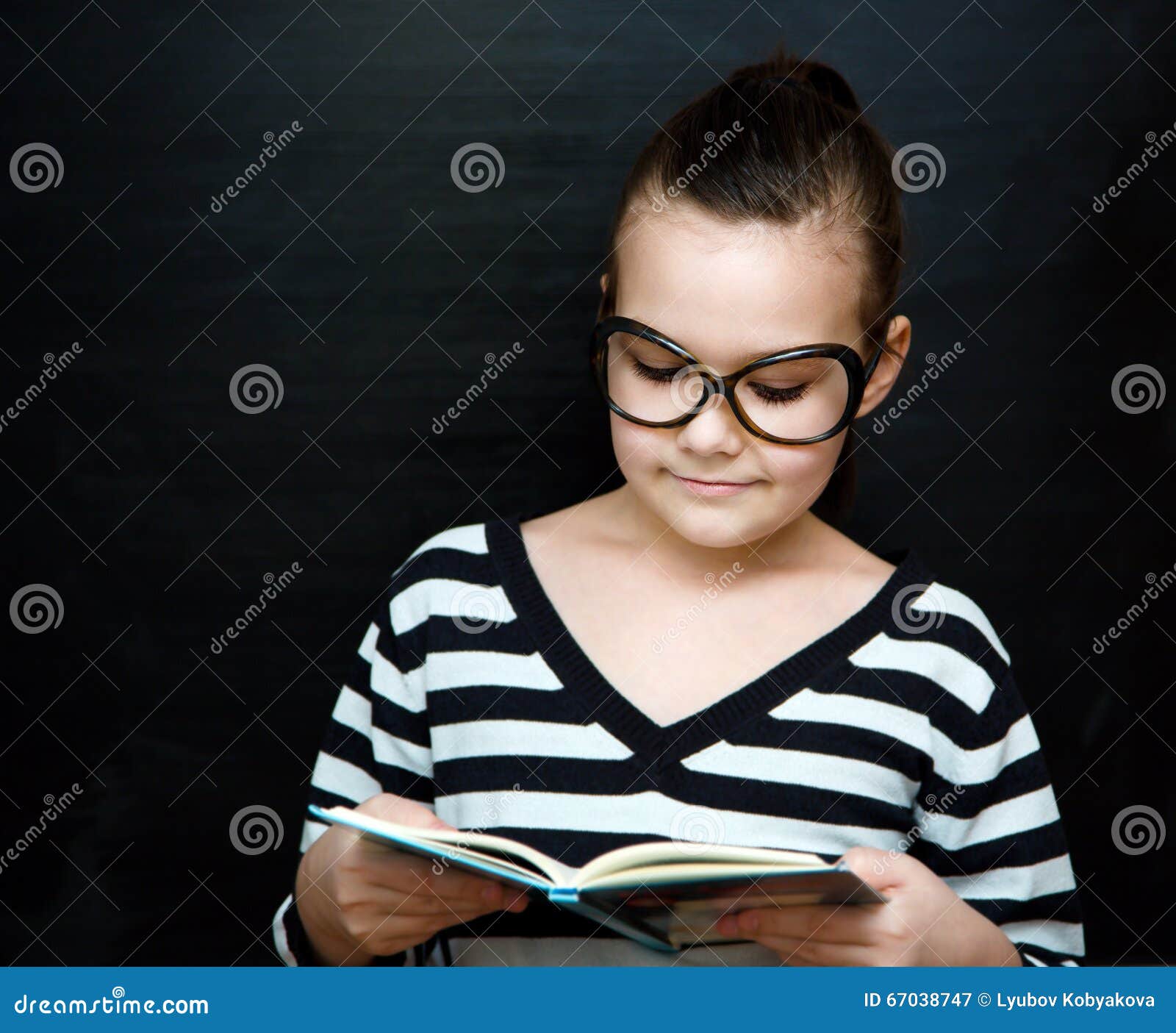 Girl is reading a book stock image. Image of female, holding - 67038747