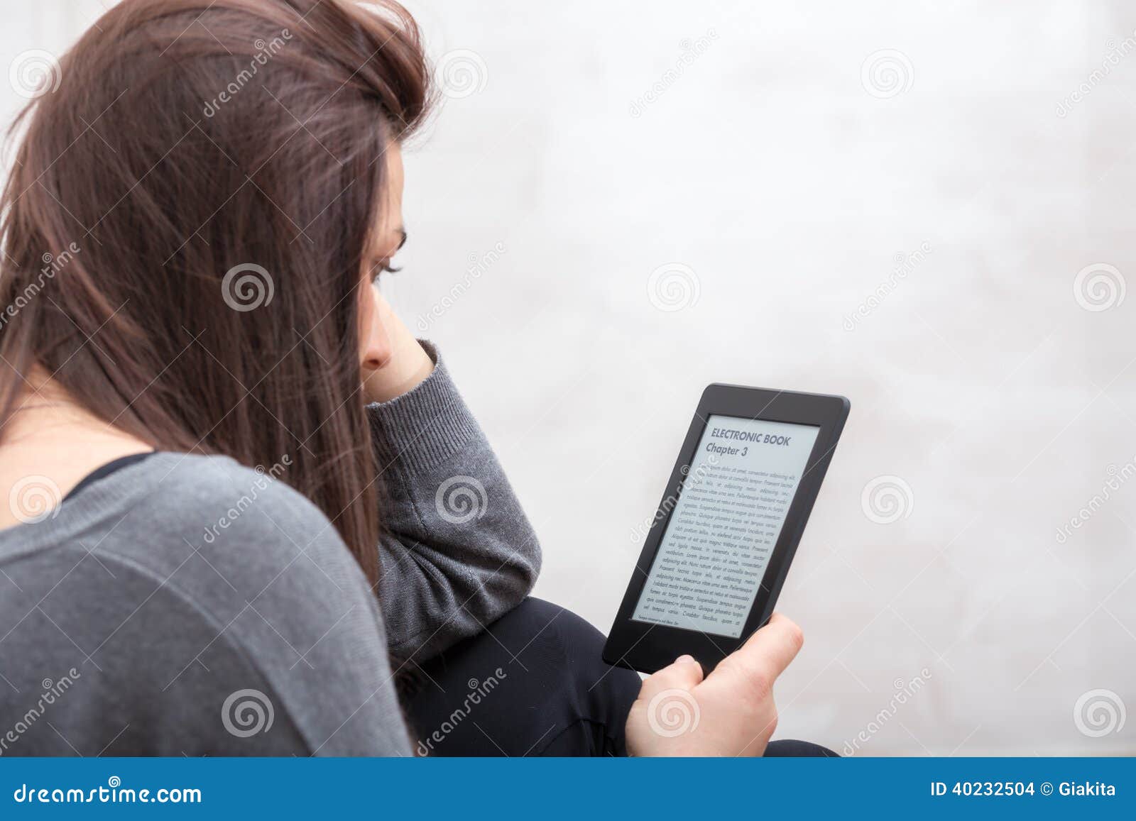 Girl is Reading a Book with an E-book Reader Stock Photo - Image of ...