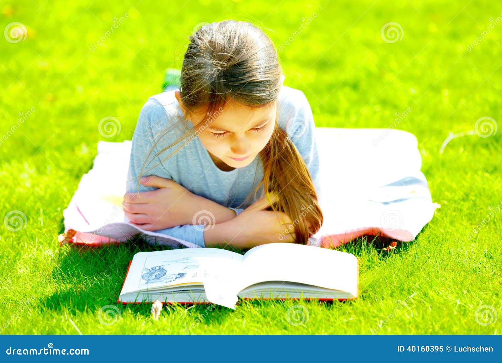 Girl Reading Book on the Grass Stock Image - Image of summer, kids ...
