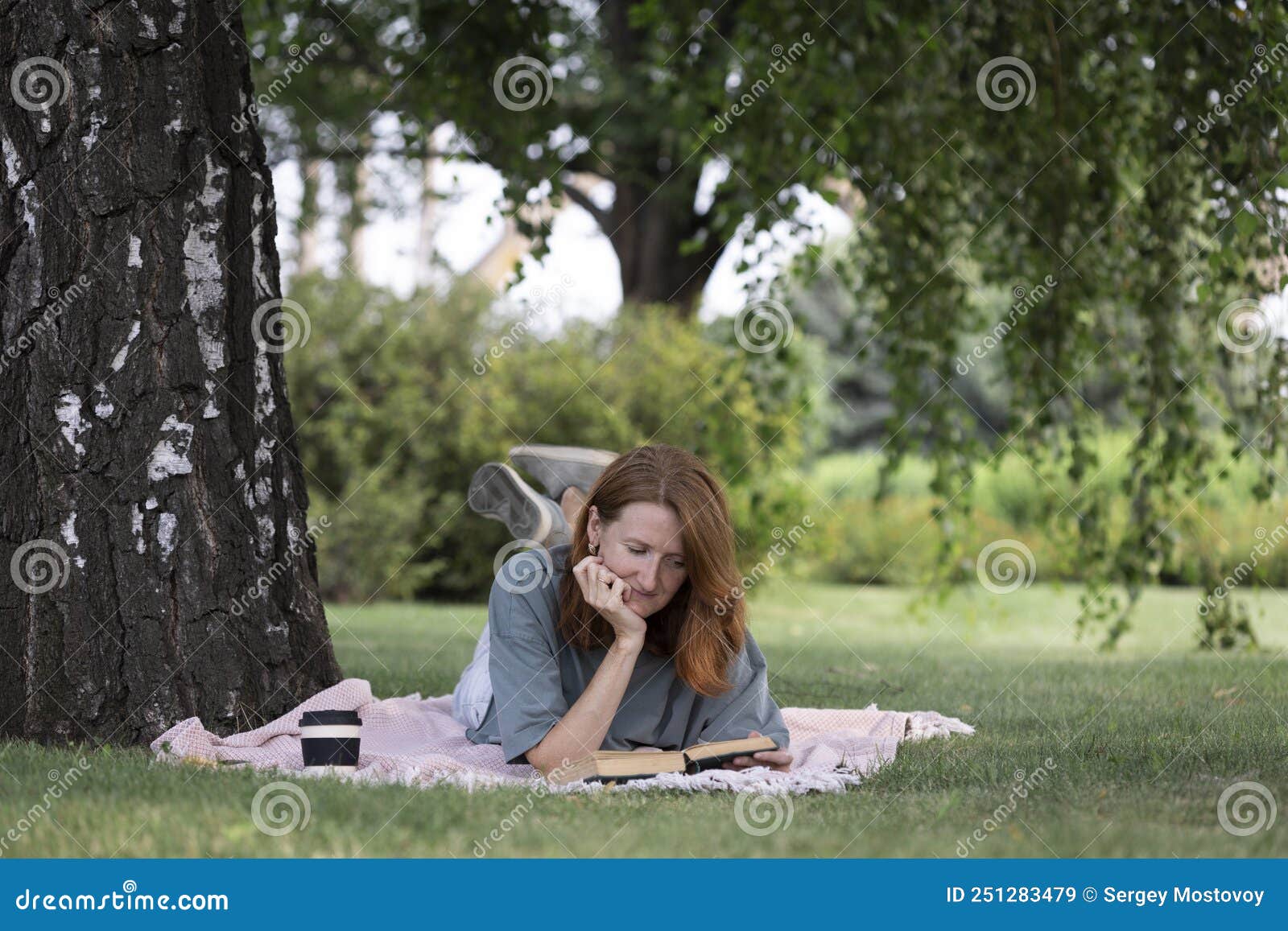 Girl Reading a Book on Lawn Stock Image - Image of leisure, happy ...