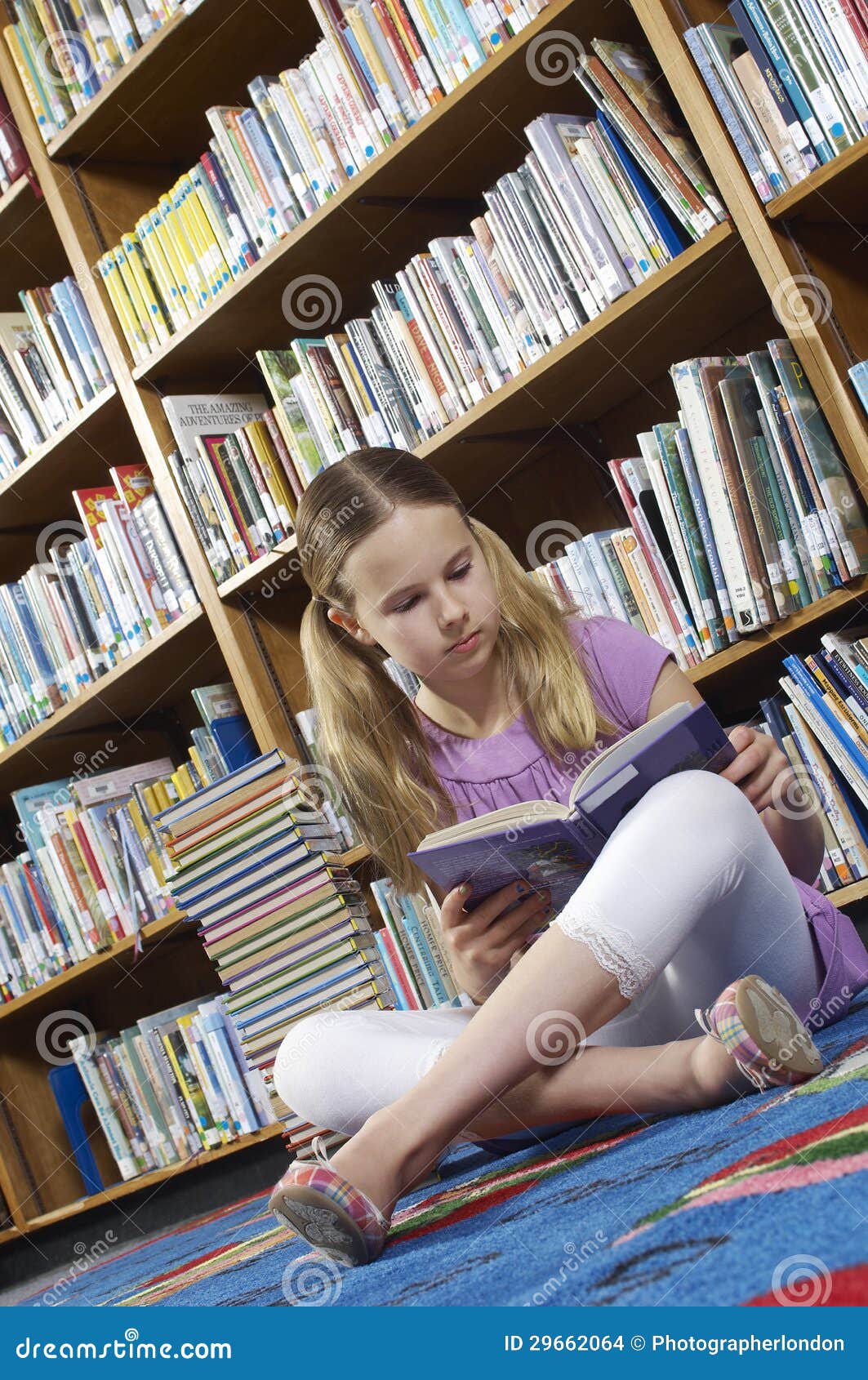 Girl Reading Book in Library Stock Photo - Image of education ...