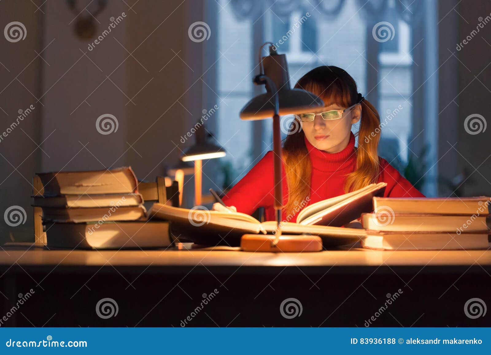 Girl Reading a Book in the Library Under the Lamp Stock Photo - Image ...