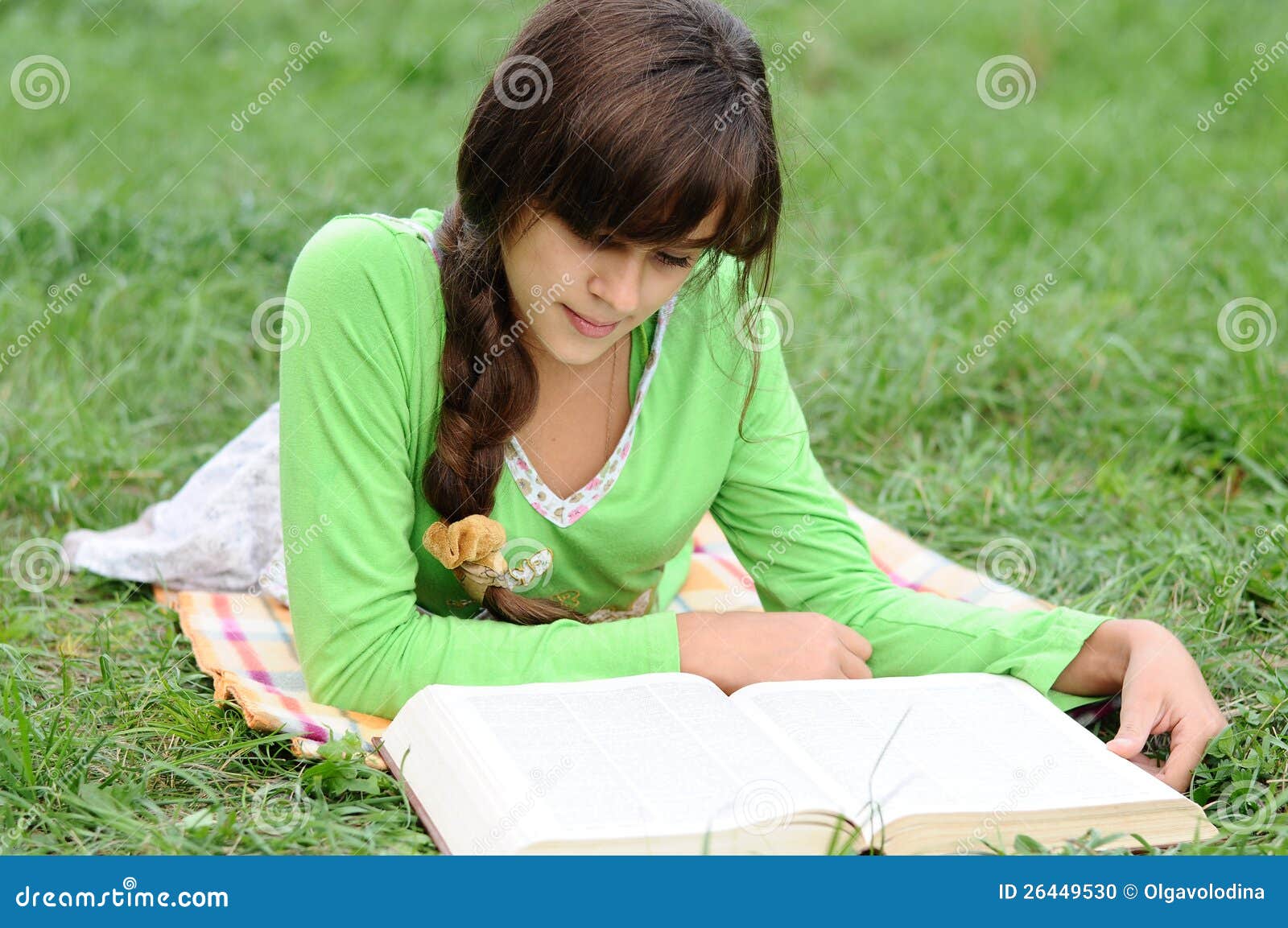 Girl Reading a Book Lying on Grass Stock Photo - Image of person, grass ...