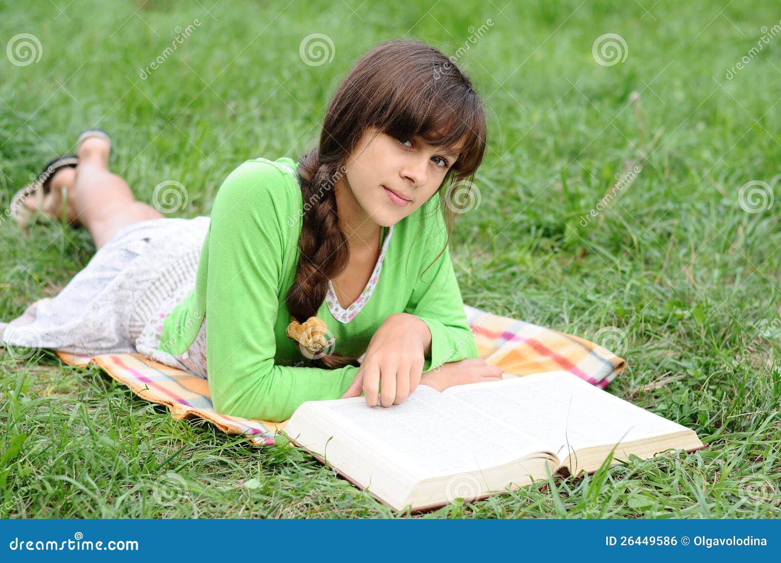 Girl Reading a Book Lying on Grass Stock Photo - Image of beauty, girl ...