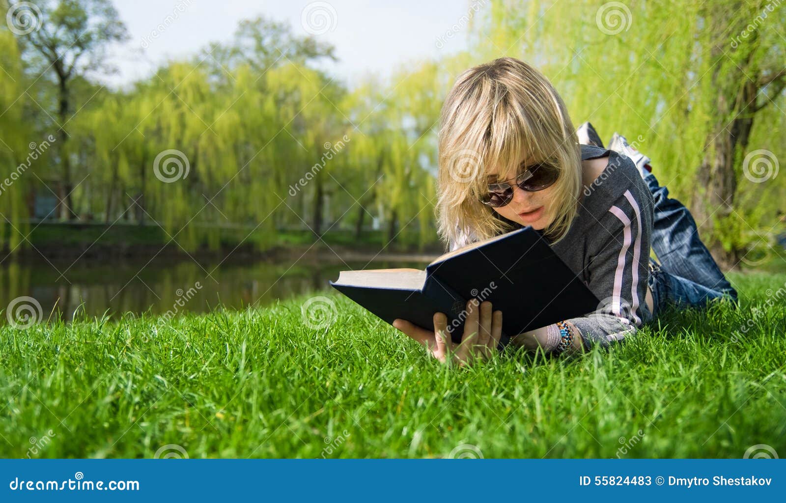 Girl Reading a Book Lying on the Grass Stock Image - Image of ethnicity ...