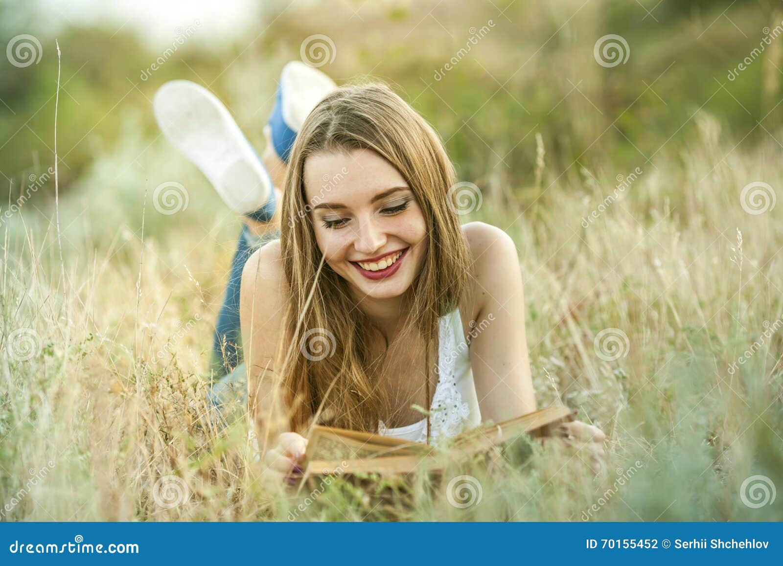 A Girl Reading a Book Outside Stock Photo - Image of park, female: 70155452