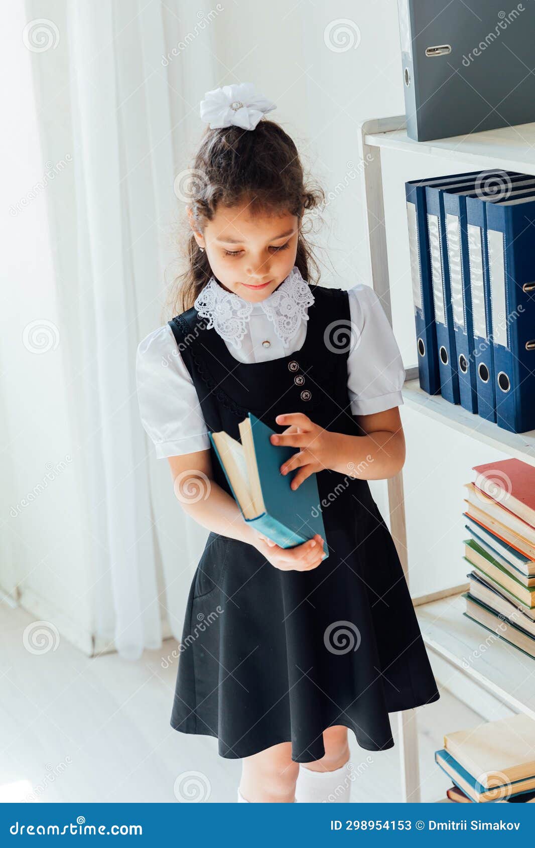 Little Girl Reading a Book in School Library Stock Image - Image of ...