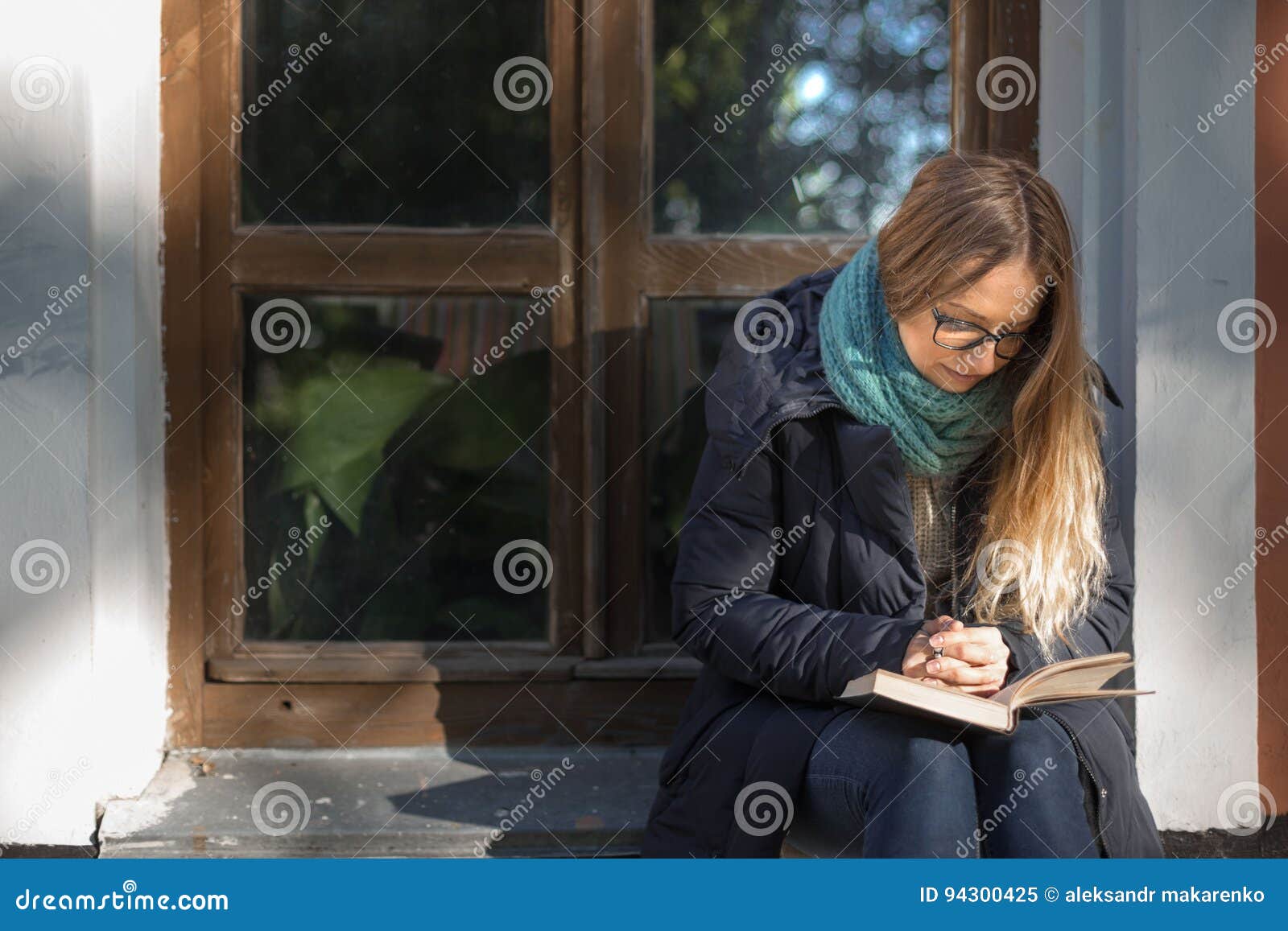 The Girl is Reading a Book Sitting by the Window Stock Image - Image of ...