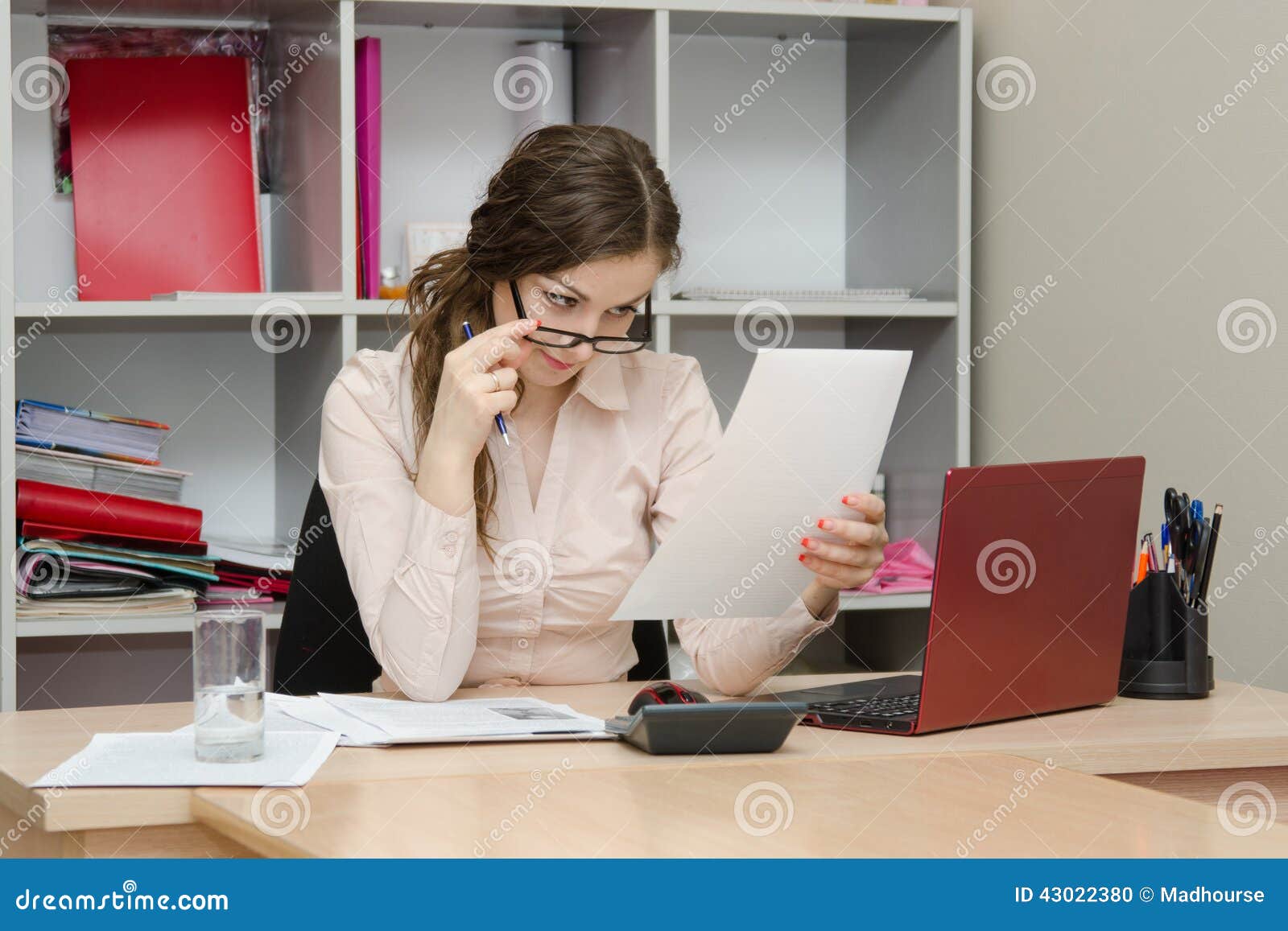 Girl Reading a Document in the Workplace Stock Photo - Image of ...