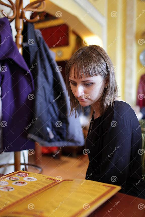 Girl reading menu stock photo. Image of decisions, food - 25123340