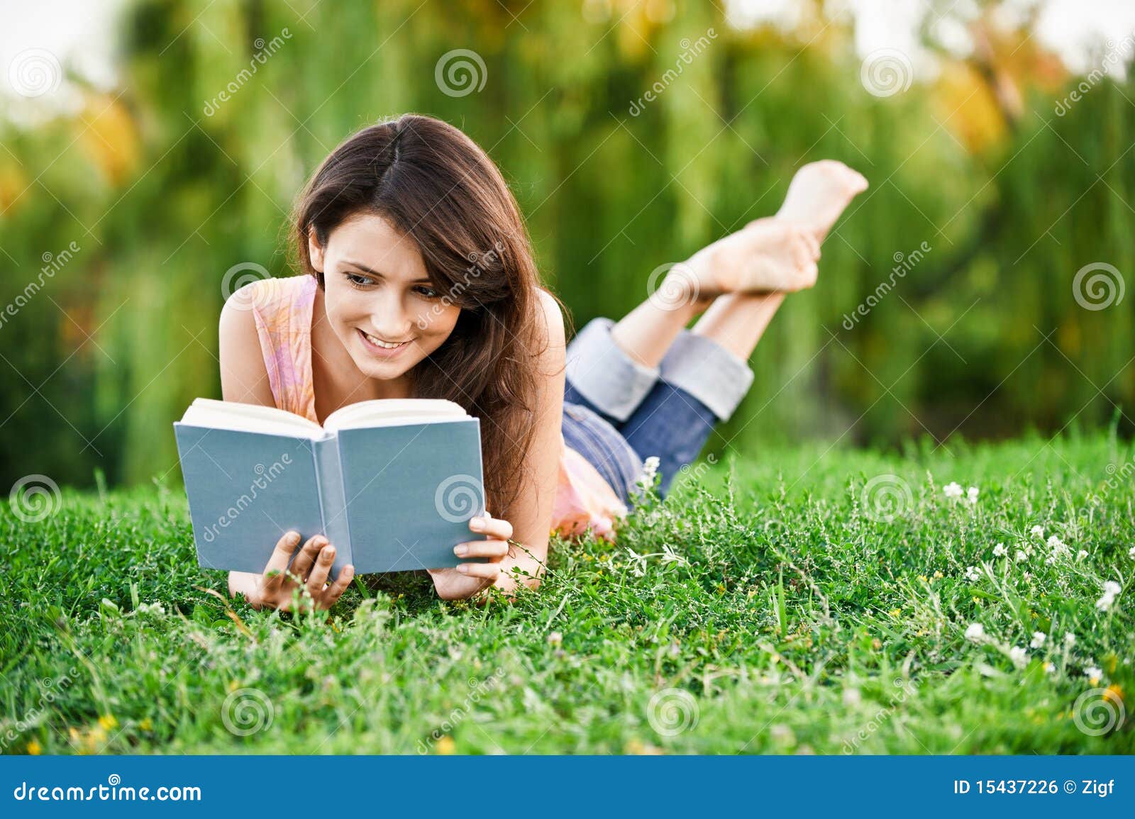 Girl reads book stock photo. Image of horizontal, green - 15437226