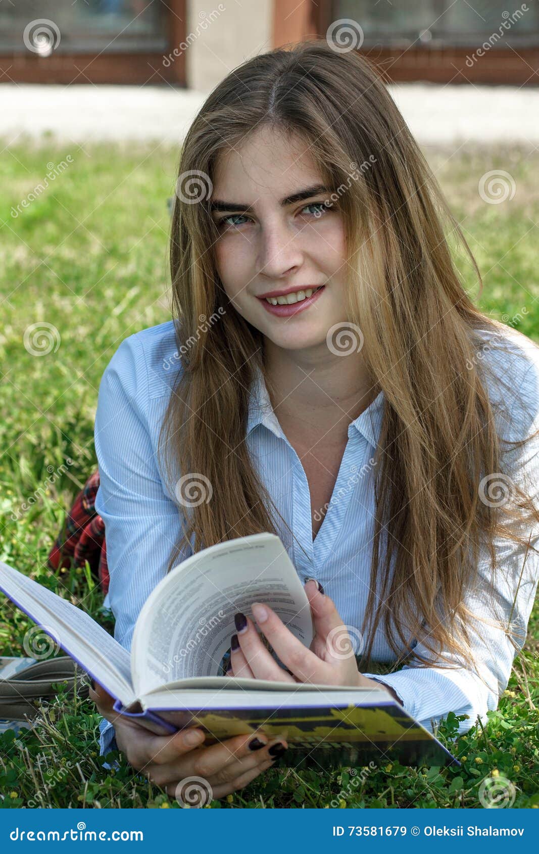 Girl Reads a Book while Lying on the Grass Stock Image - Image of ...