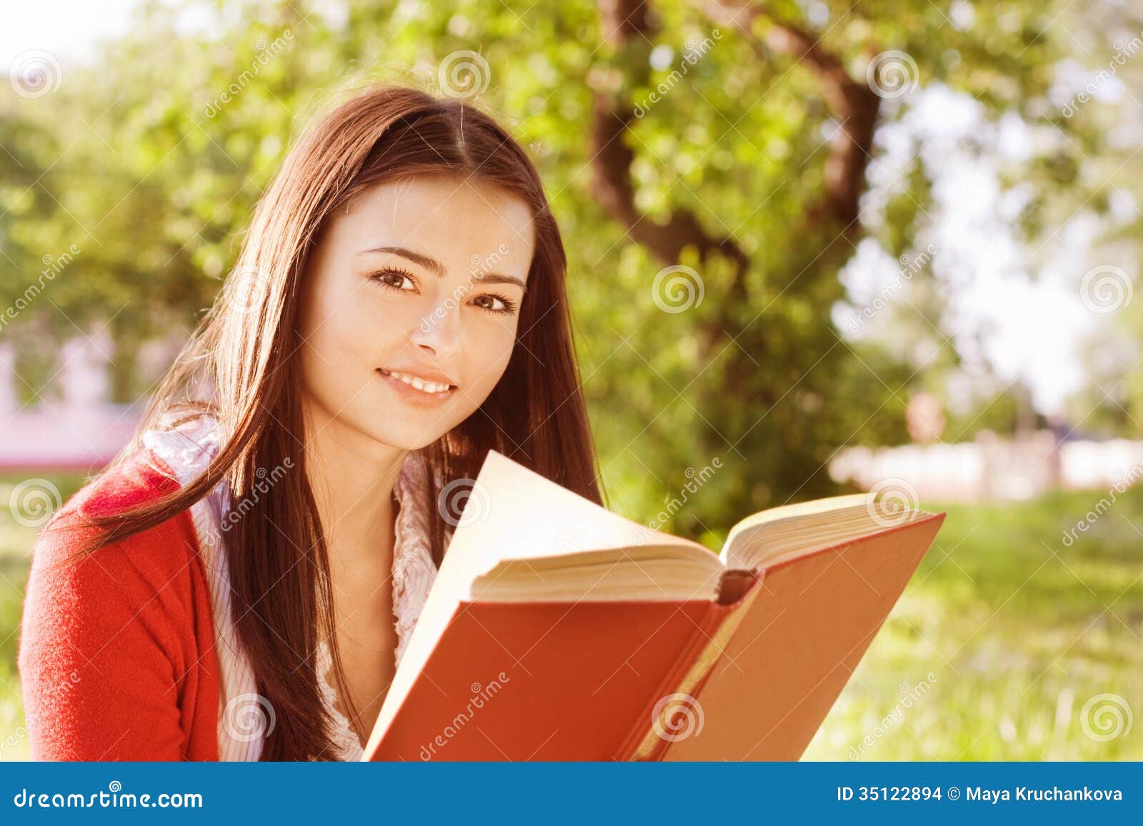 Girl reads book in a park stock photo. Image of leisure - 35122894