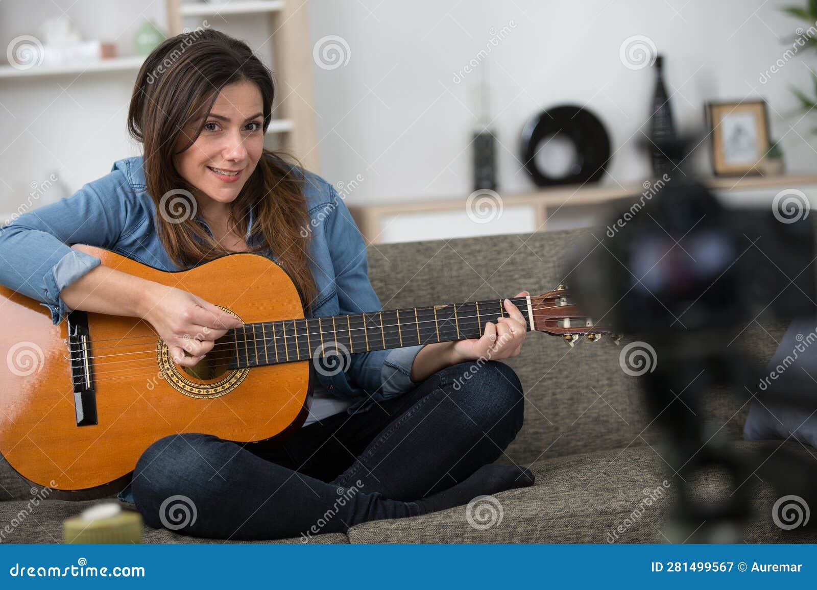 Girl Records Oncamera Tutorial Vlog for Playing Acoustic Guitar Stock ...