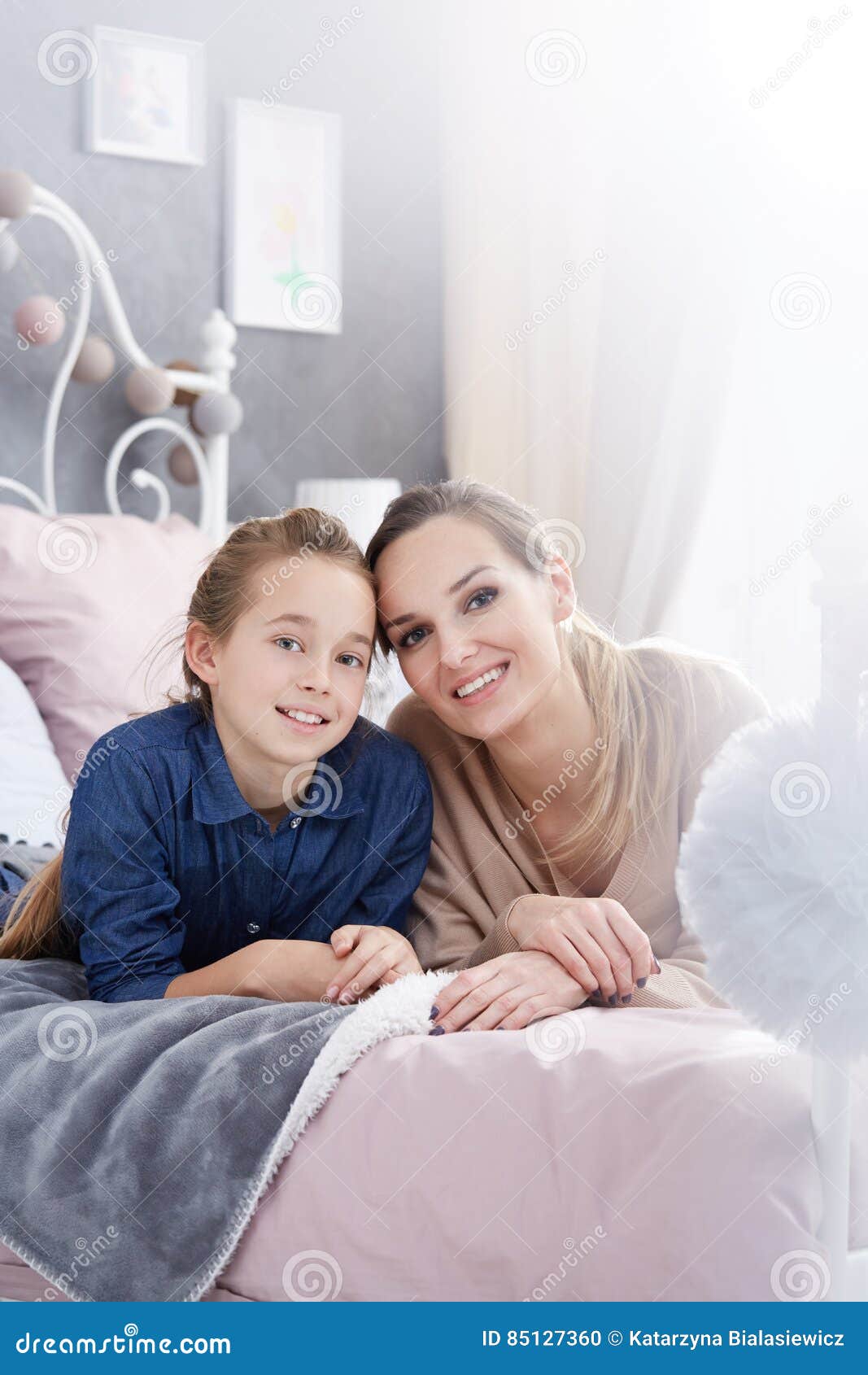 Girl relaxing with mother stock photo. Image of bond - 85127360