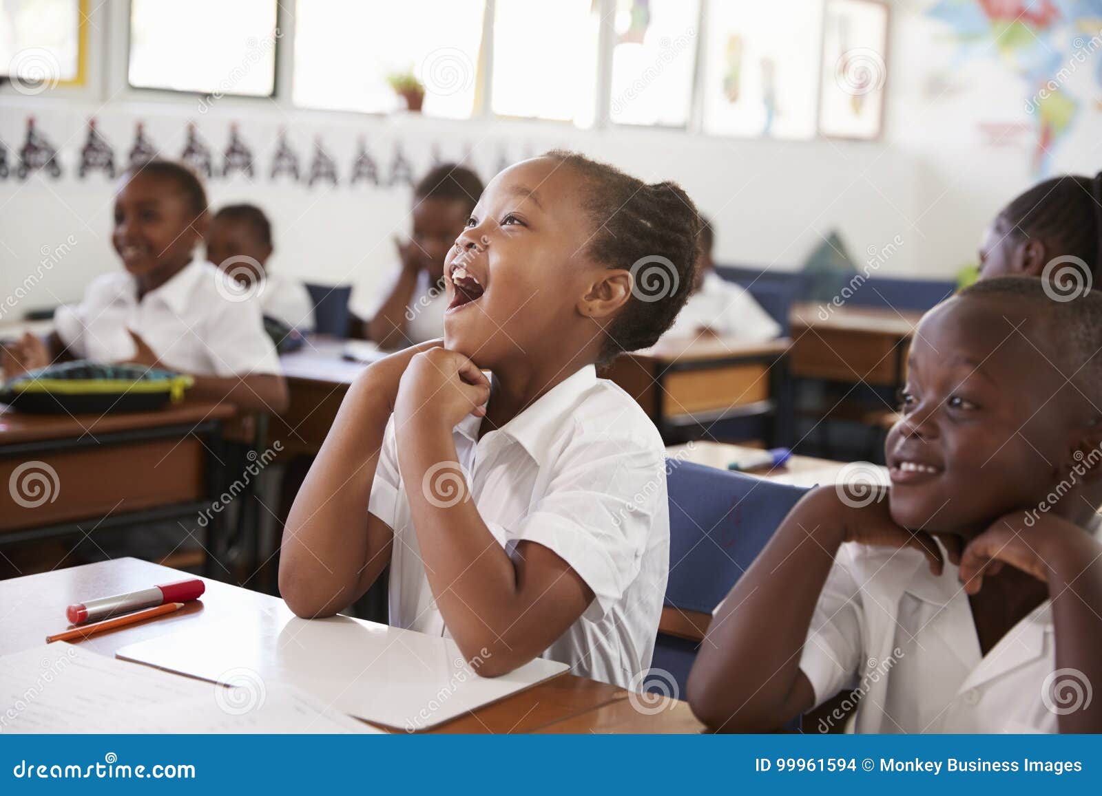 Girl Responding during a Lesson at an Elementary School Stock Photo ...