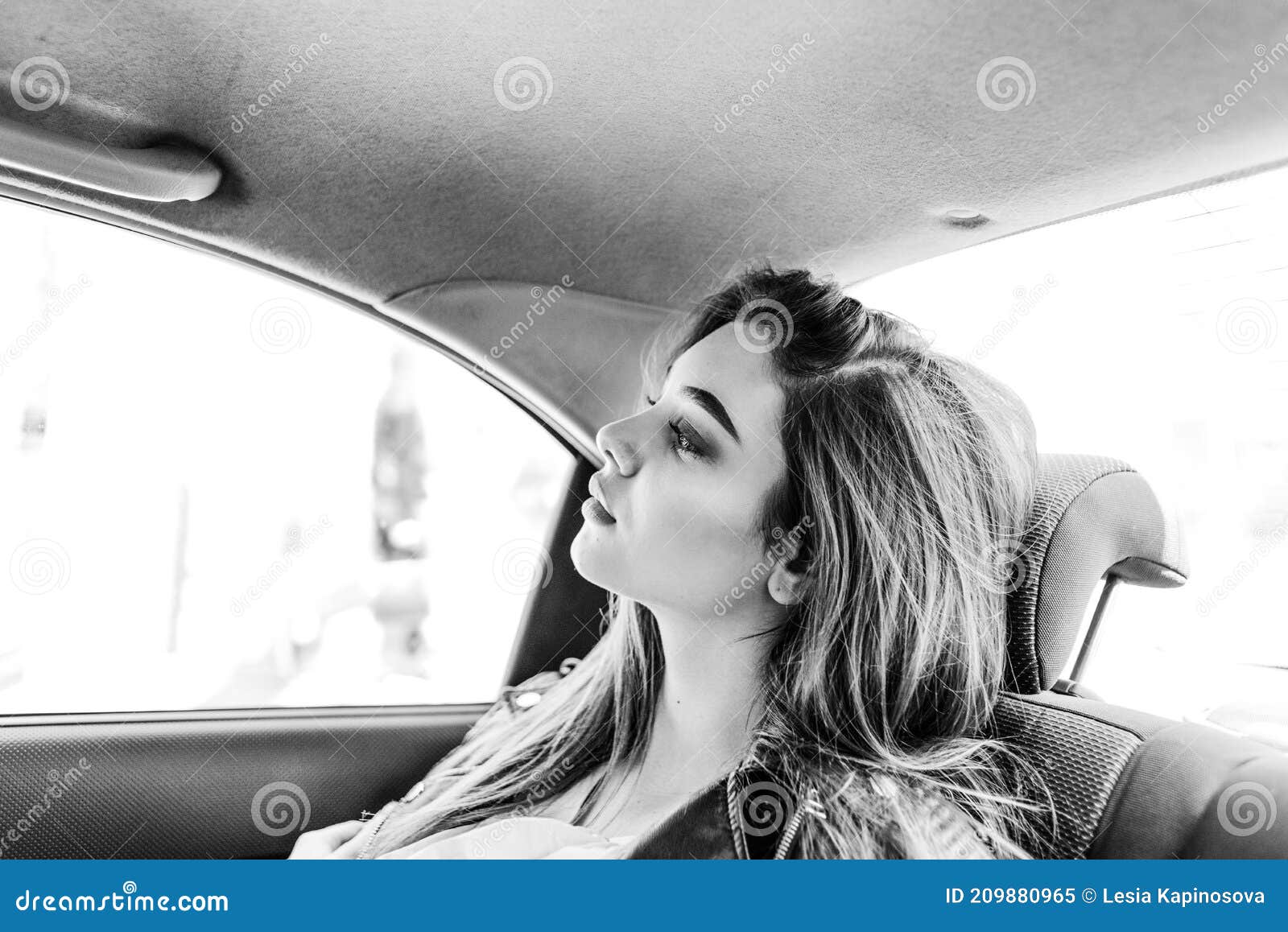 Girl Rides In A Car Beautiful Young Girl Rides In A Taxi In The Back