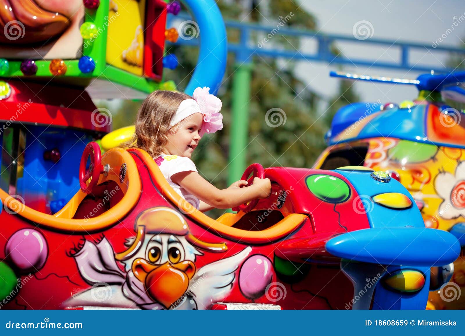 Girl riding on a carousel stock image. Image of lights - 18608659
