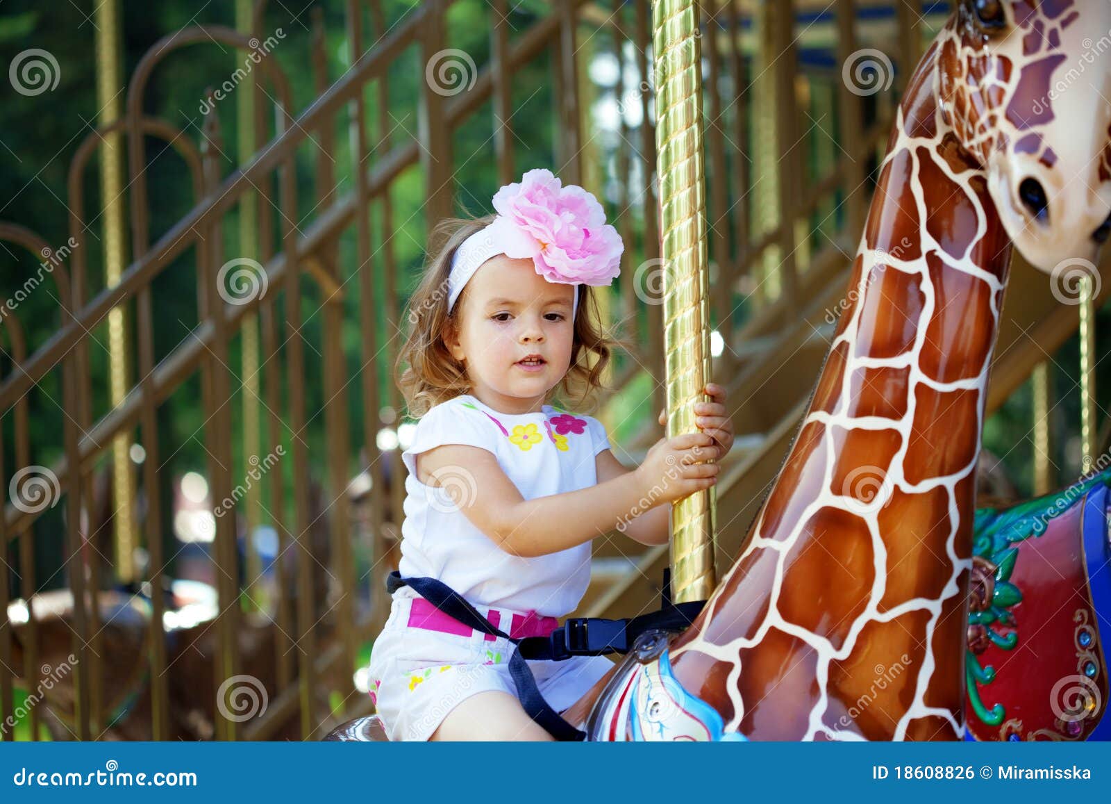 Girl riding on a carousel stock photo. Image of leisure - 18608826