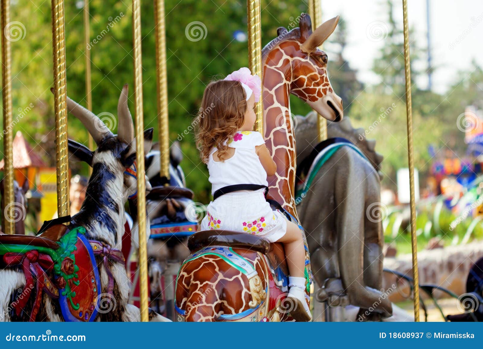 Girl riding on a carousel stock image. Image of carnival - 18608937