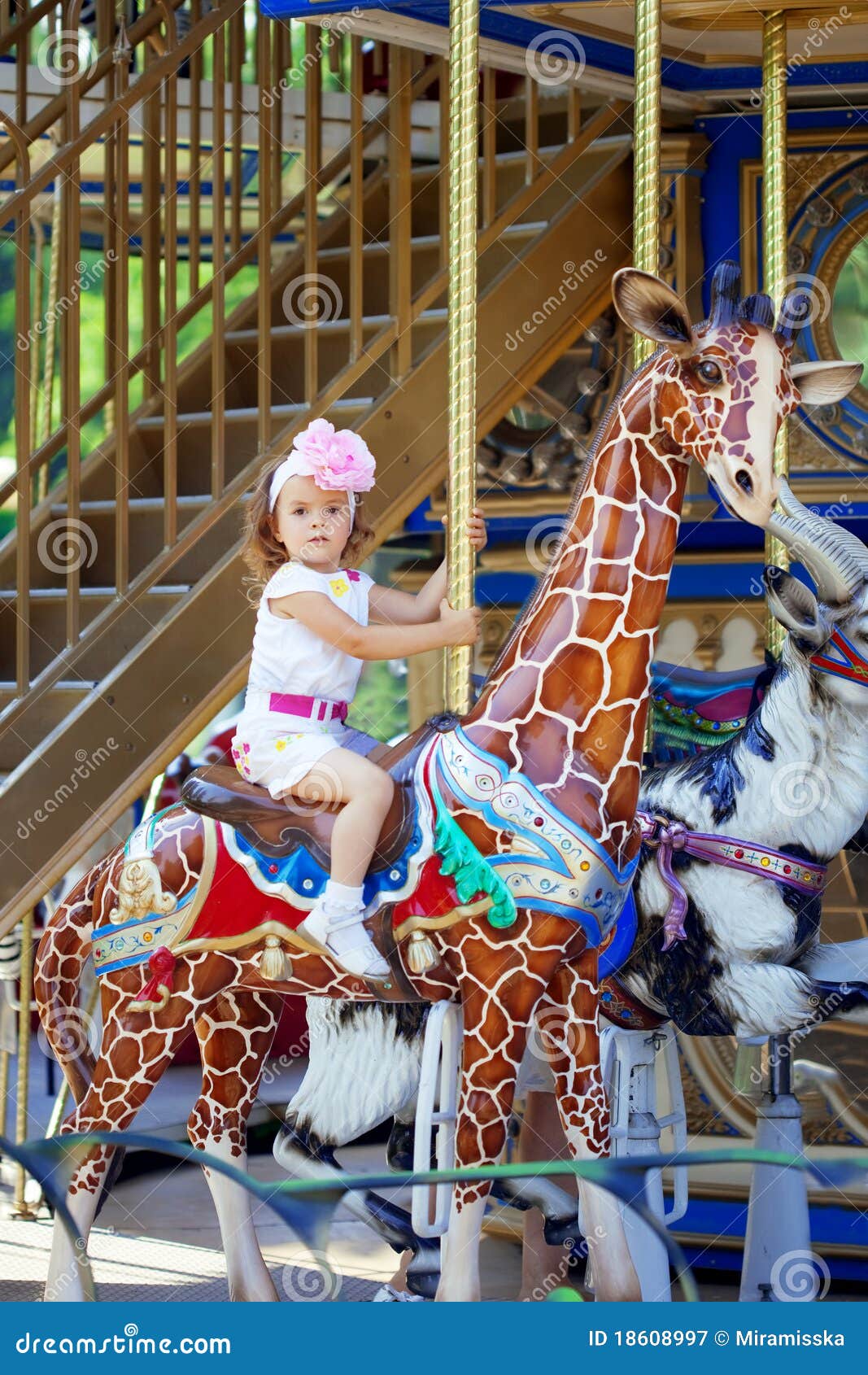 Girl riding on a carousel stock image. Image of circle - 18608997