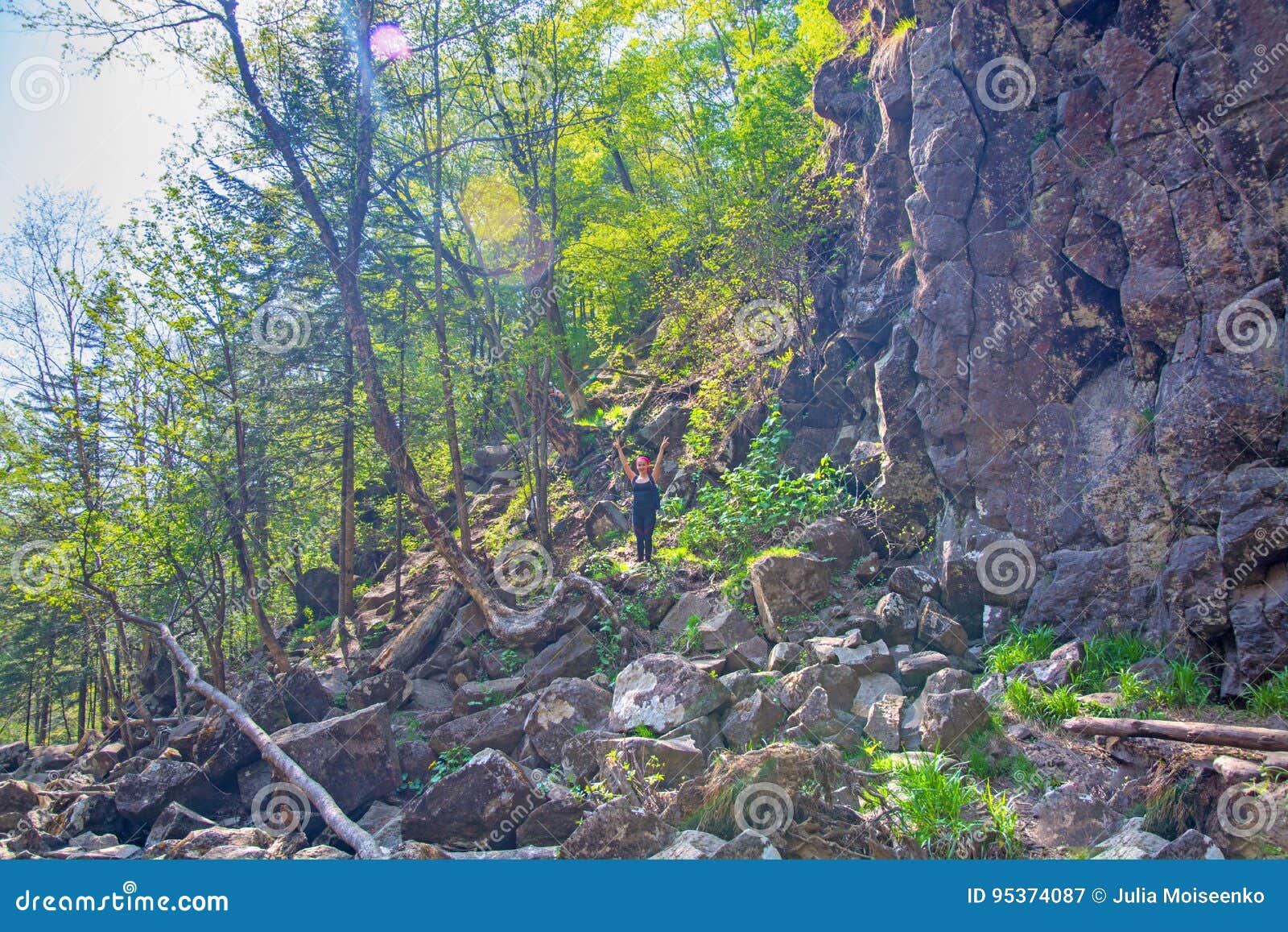 The Girl Rises through Beautiful Forested Cliff, Lots of Greenery and ...