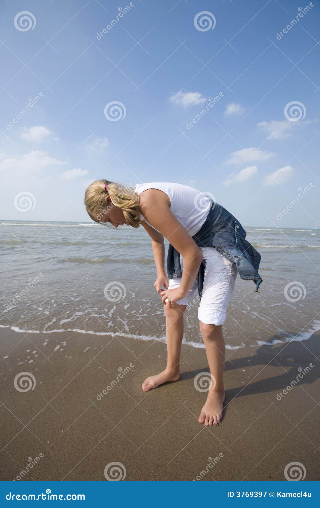 Girl rolling up her pants stock image. Image of active - 3769397