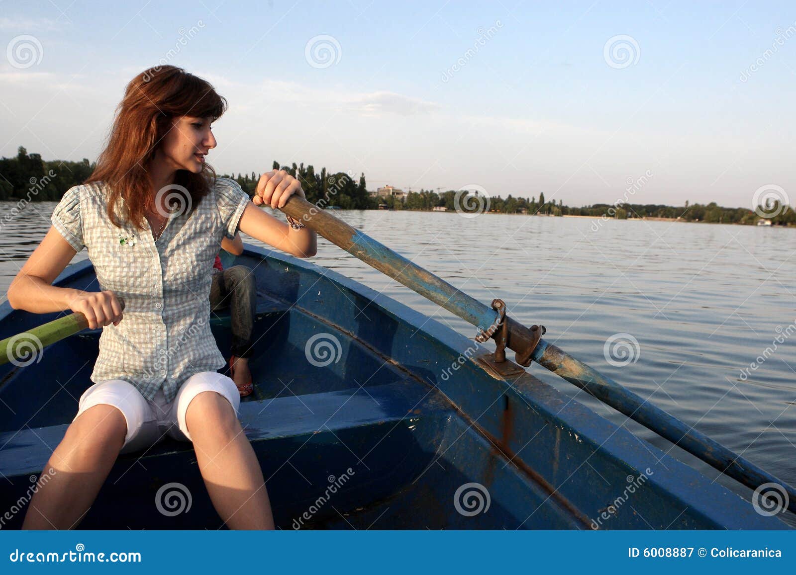 Girl rowing a boat stock image. Image of park, friend - 6008887
