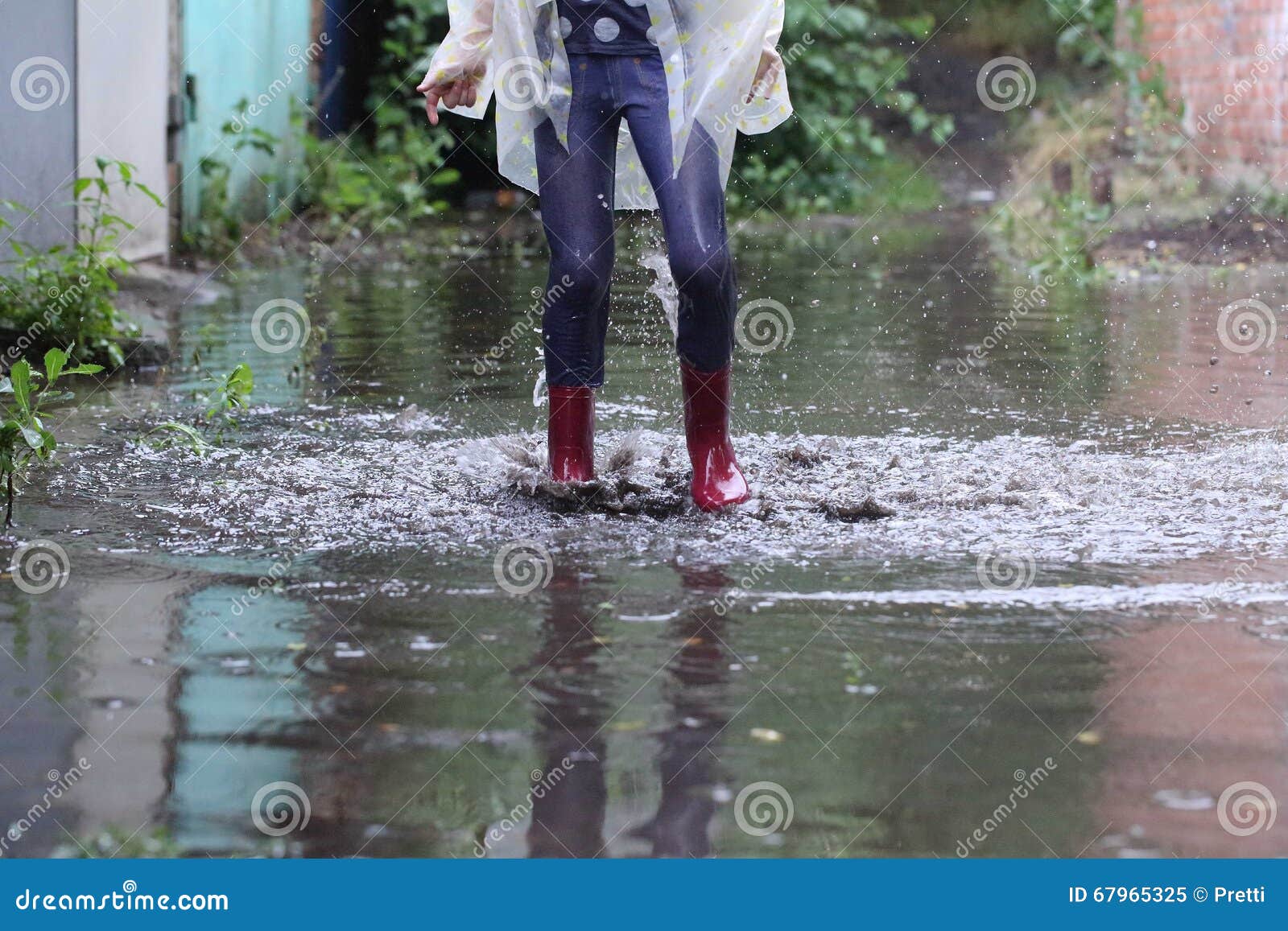 Girl in Rubber Boots Jumping in a Puddle Stock Image - Image of gear ...