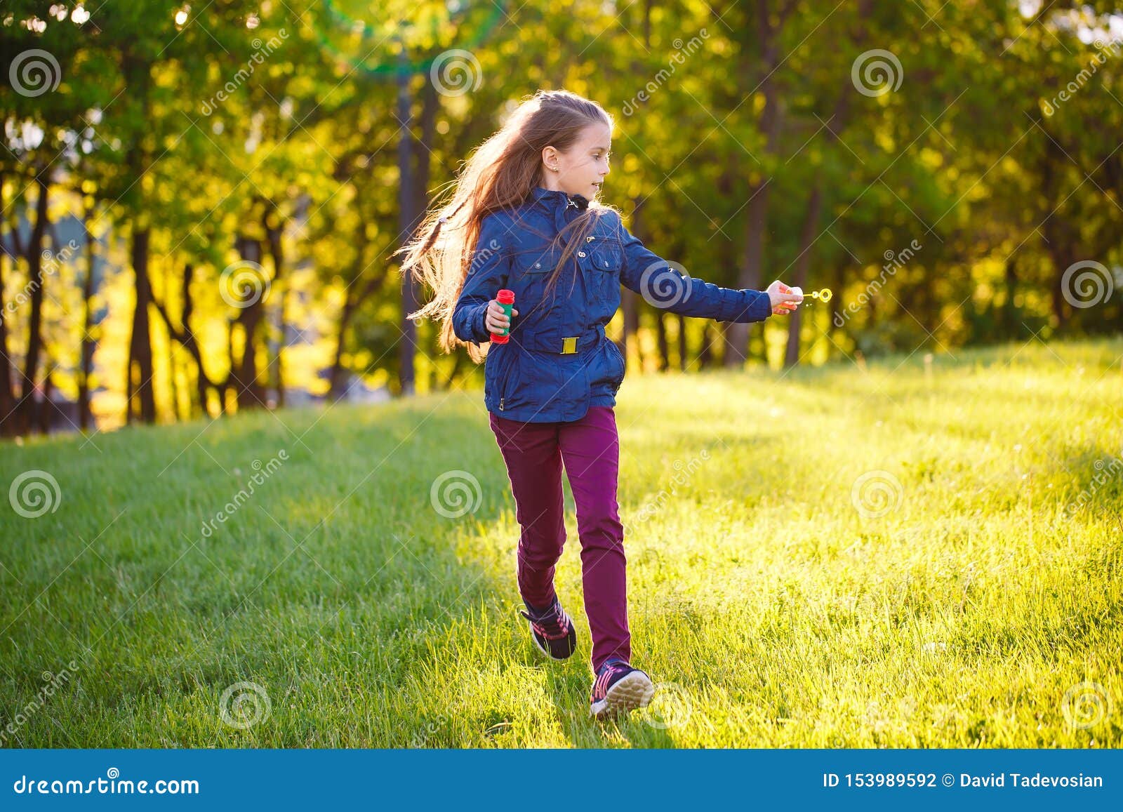 The Girl Run and Play with Soap Bubbles. Stock Photo - Image of child ...