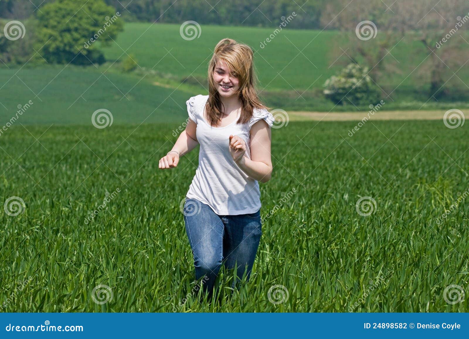 Girl Running Across a Field Stock Photo - Image of freedom, girl: 24898582
