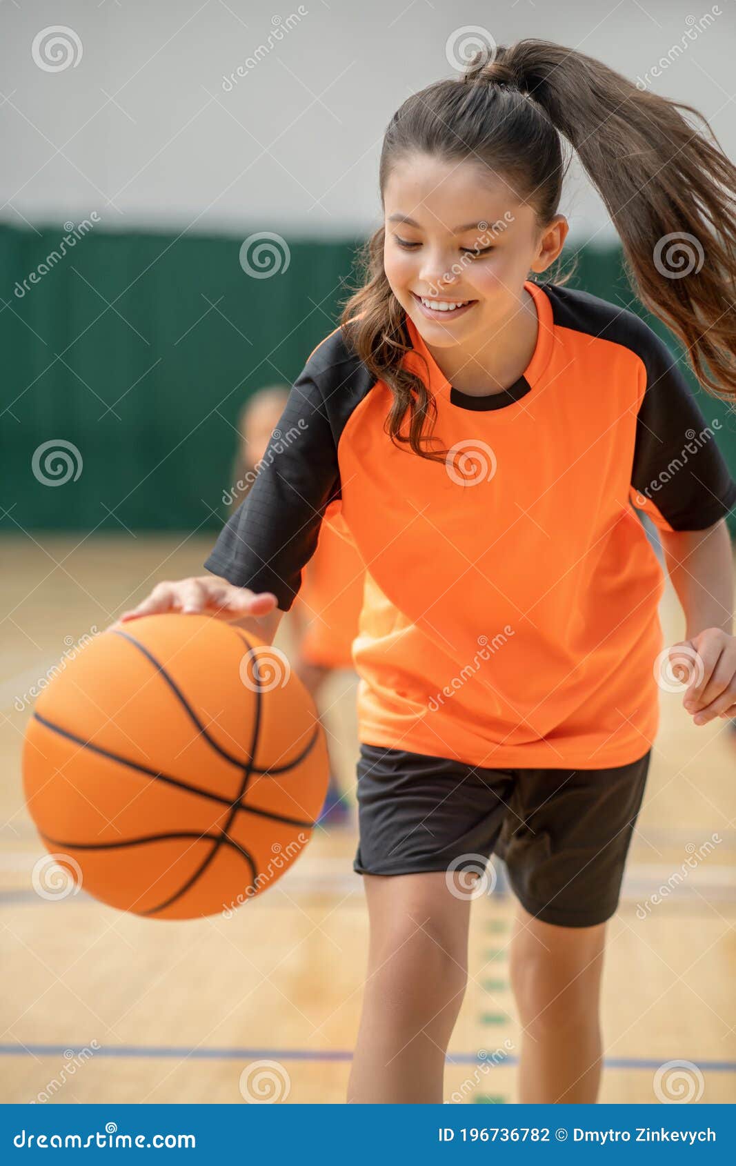 A Girl Running with a Ball and Looking Excited Stock Photo - Image of ...