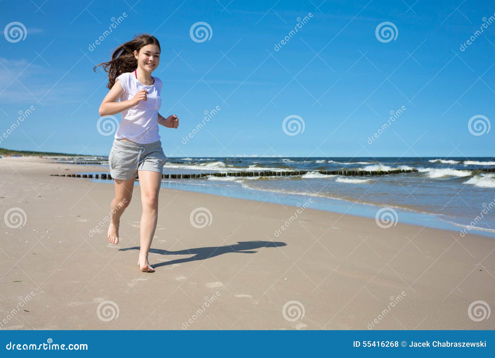 Girl running on beach stock photo. Image of jumping, caucasian - 55416268