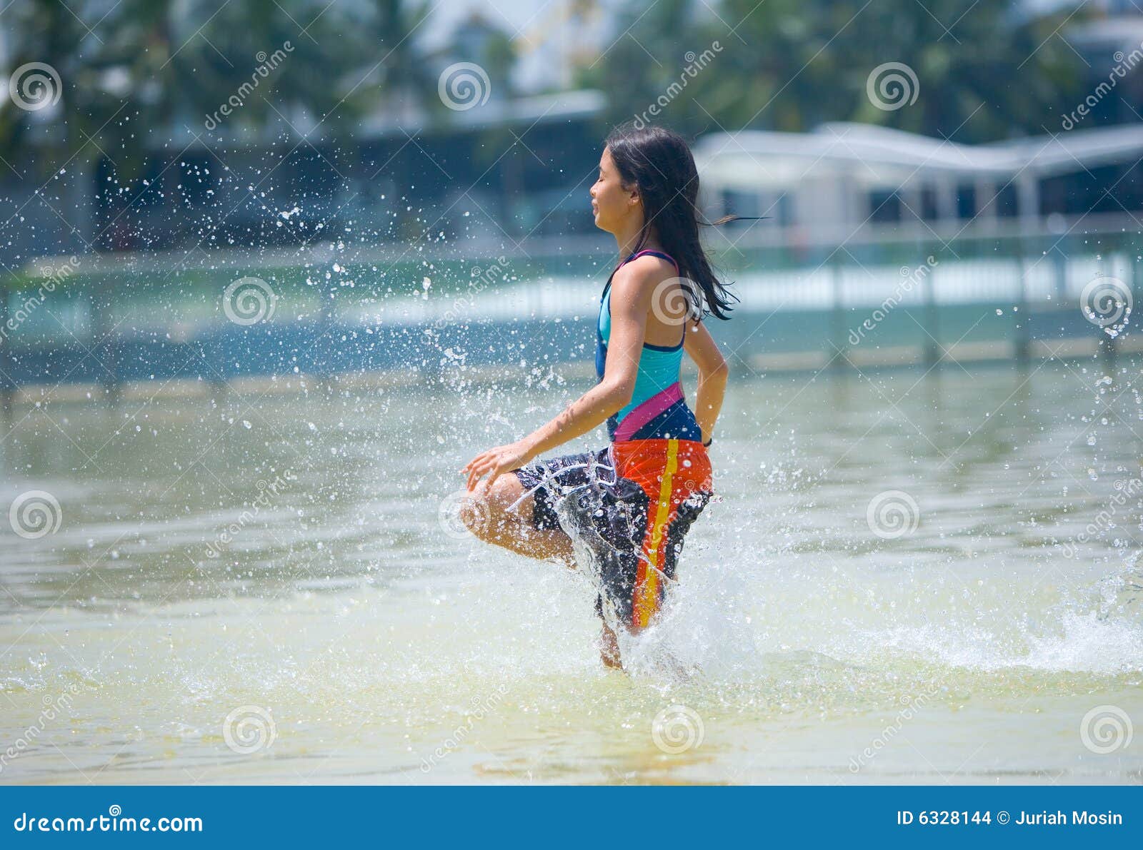 Girl Running through the Wading Pool at Water Park Stock Photo - Image ...
