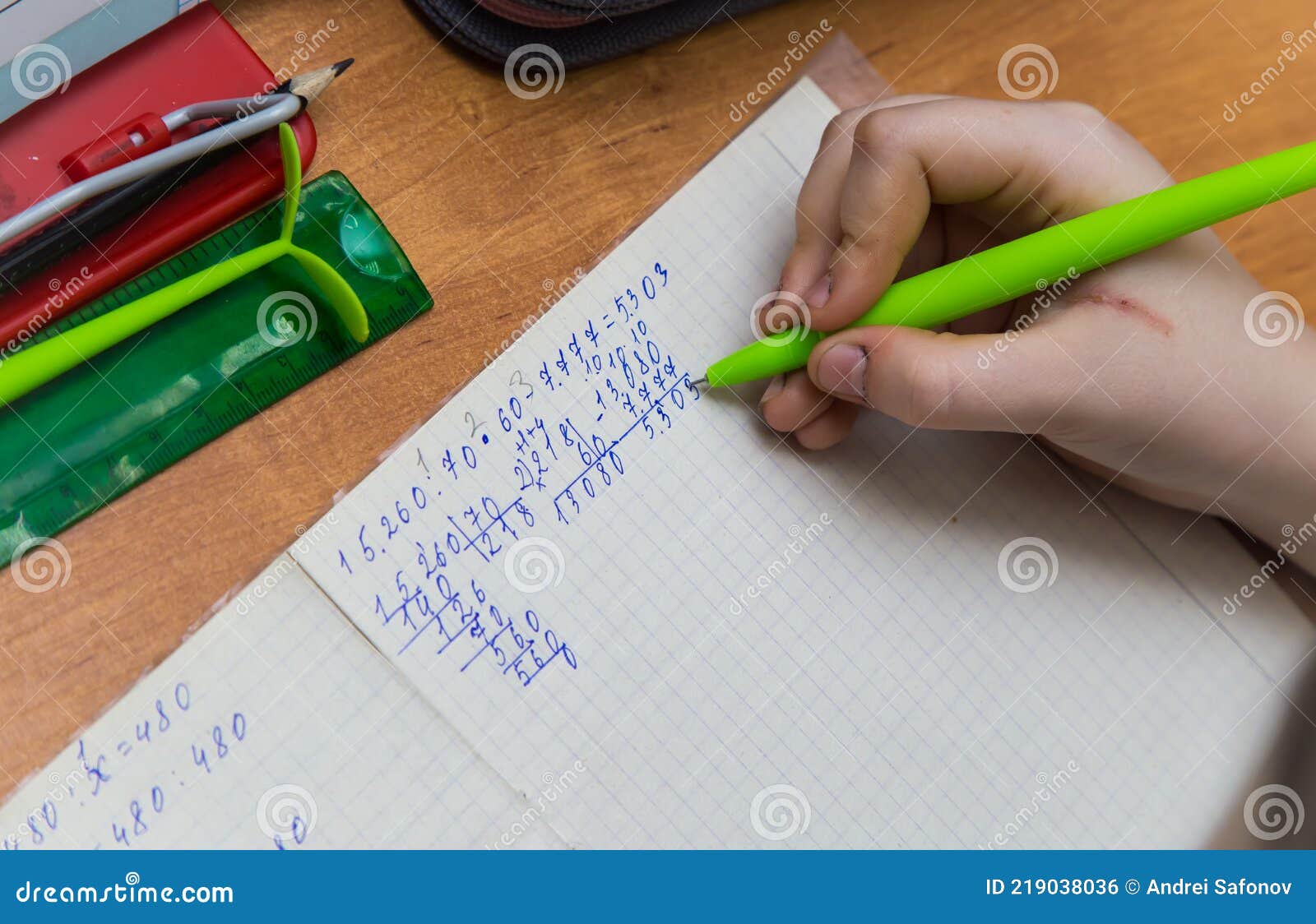 A Girl& X27;s Hand with a Ballpoint Pen Solve an Example in Mathematics ...