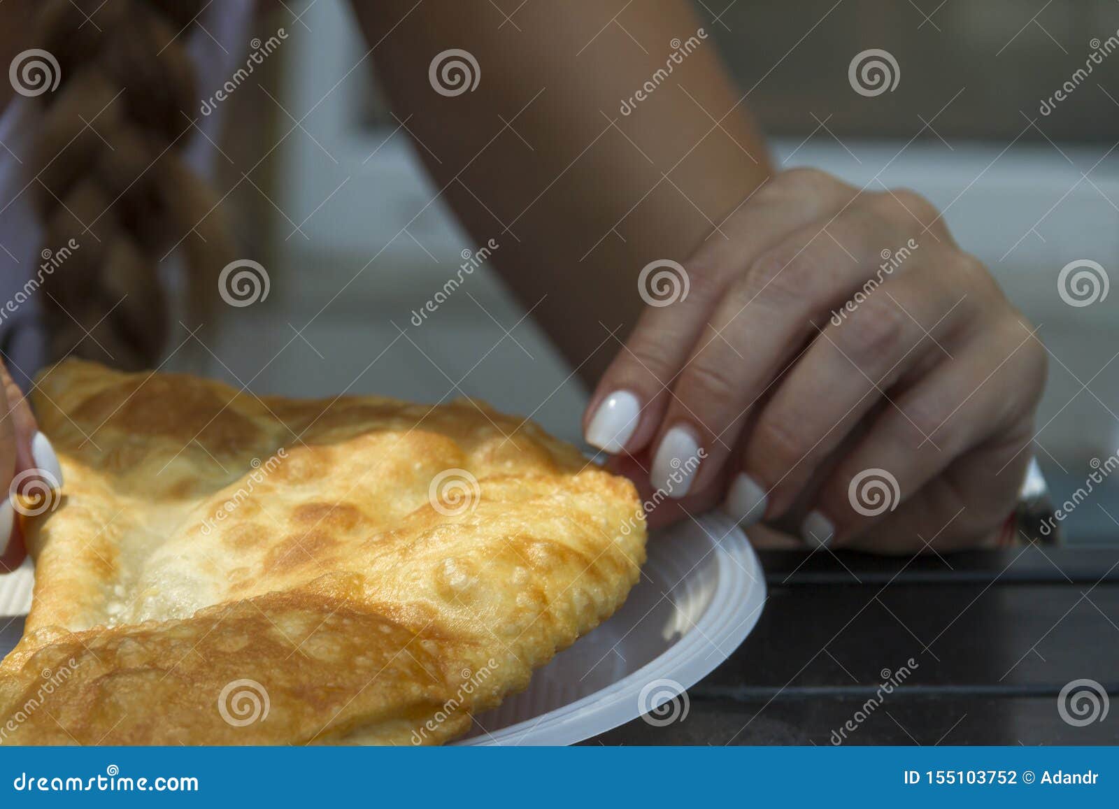 The Girl`s Hand Keeping Cheburek Over a Plate Stock Photo - Image of ...