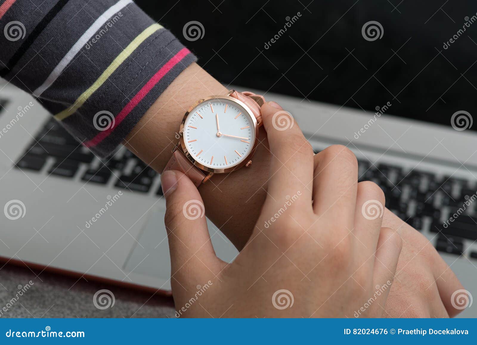 Girl`s Hand with Wrist Watch in Front of Desk with Laptop Comput Stock ...