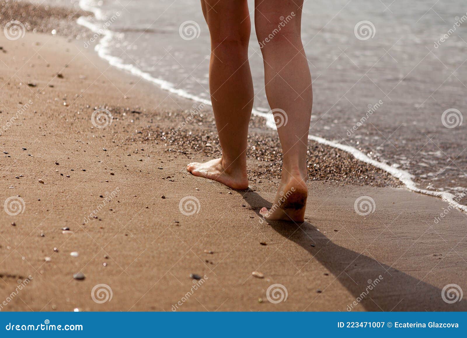 The Girland X27 S Legs Close Up Barefoot On The Sand And The Sea Shore