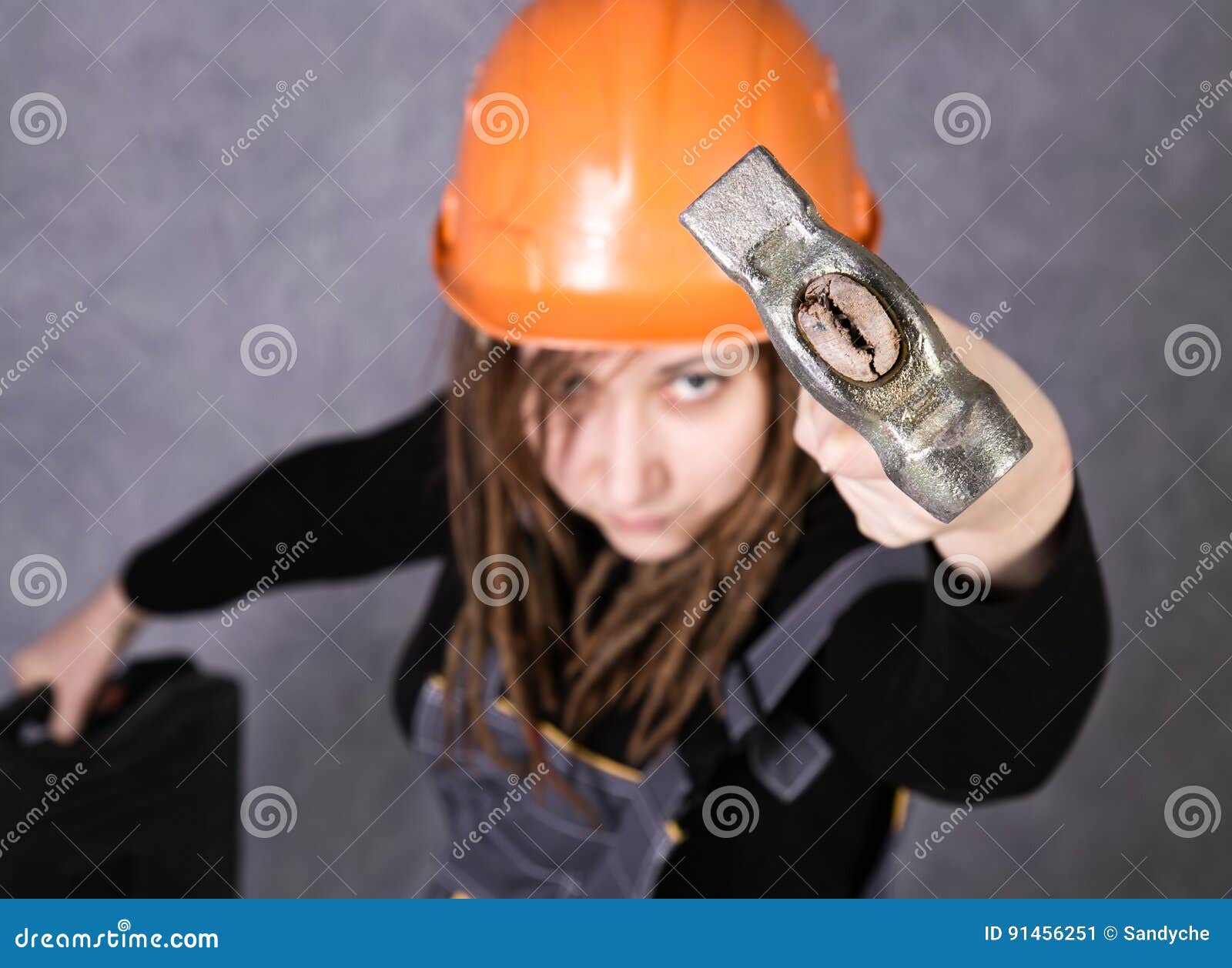 Girl In Safety Helmet Orange Vest Holding Hammer Tool Stock Image