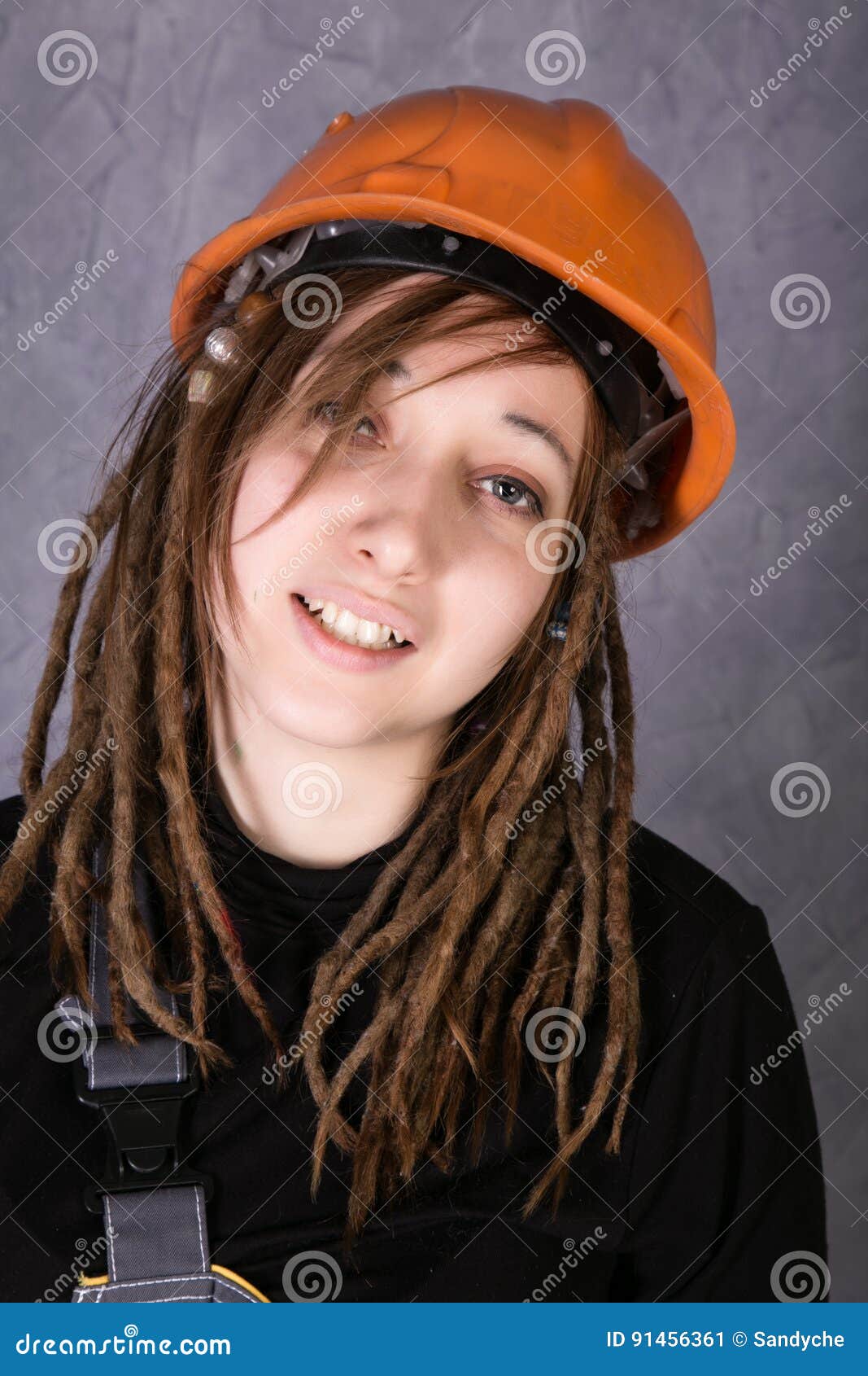 Girl In Safety Helmet Orange Vest Holding Hammer Tool Stock Image