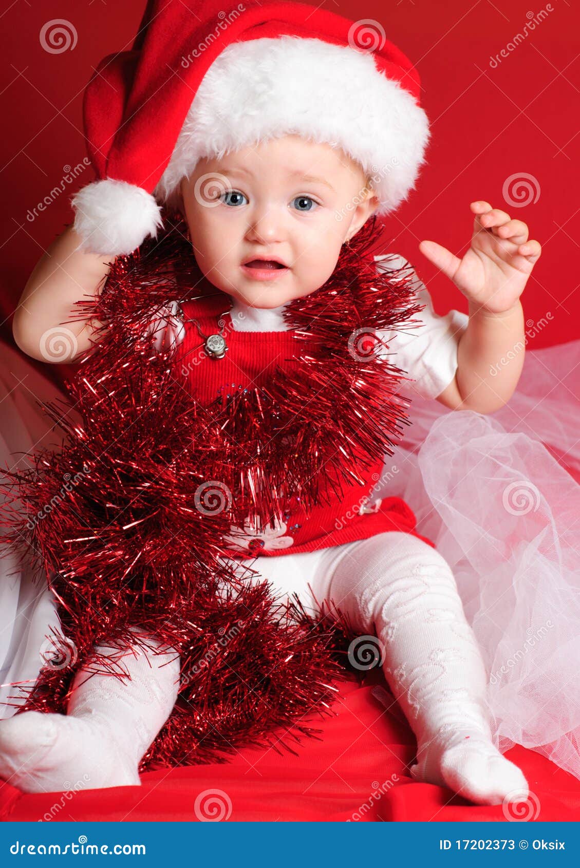 Girl santa on red cloth stock image. Image of season - 17202373