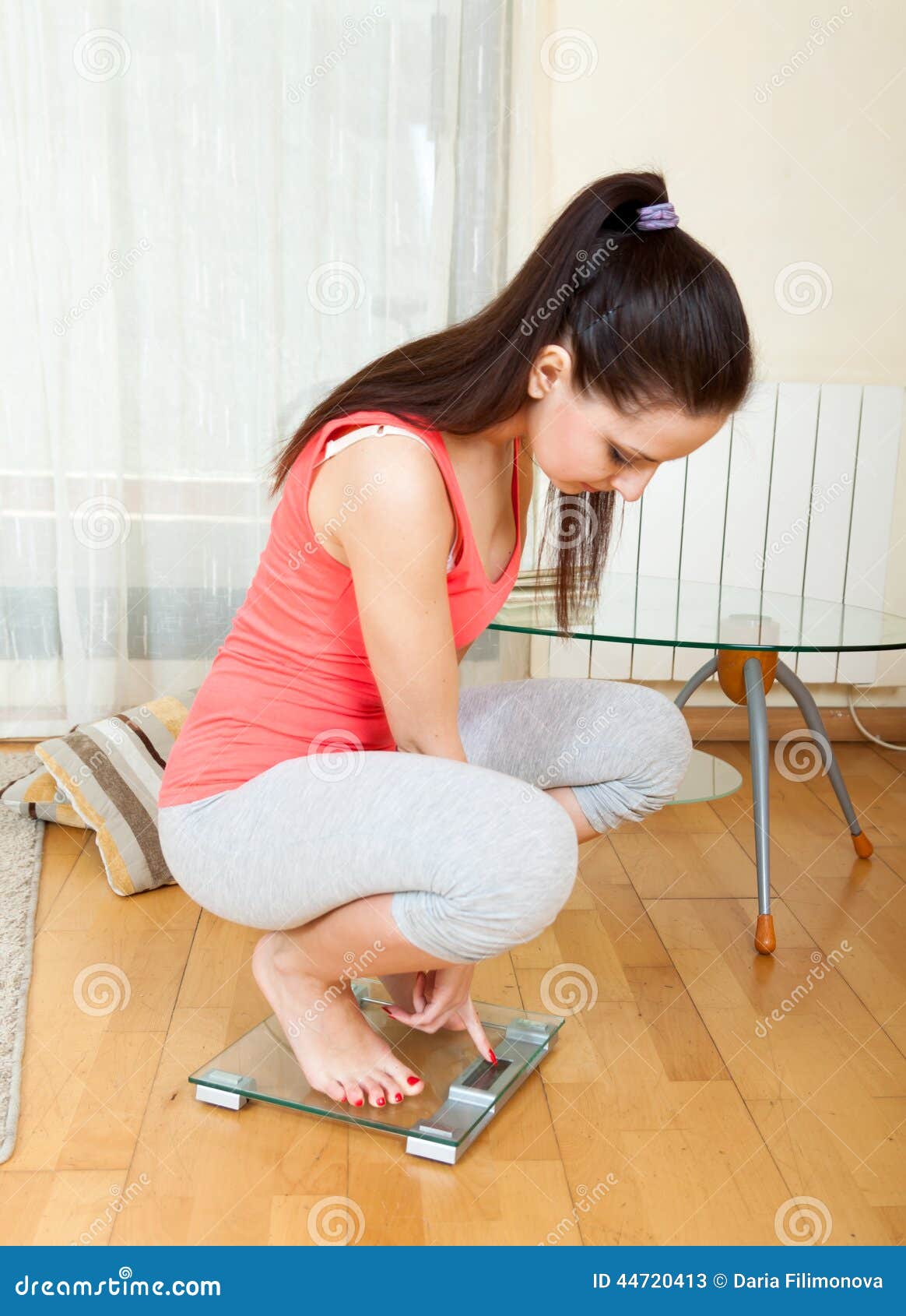 Girl on scales at home stock image. Image of imterior - 44720413