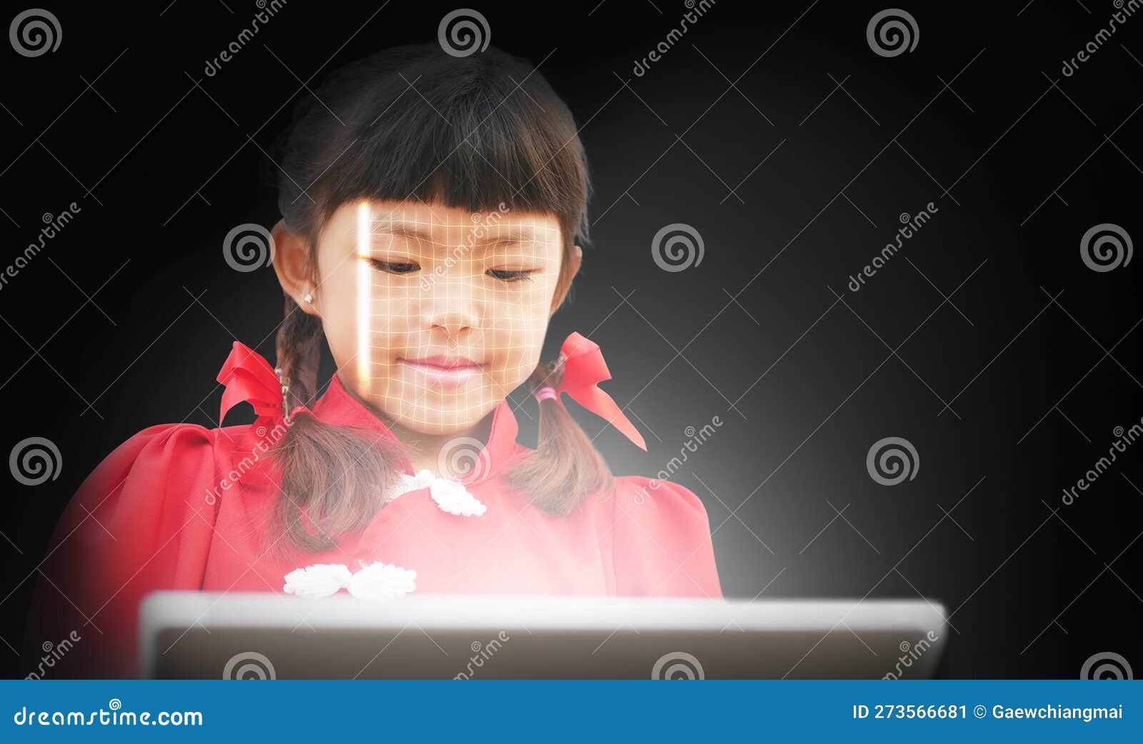 A Girl Scans Her Face Using a Tablet To Unlock it. Facial Recognition ...