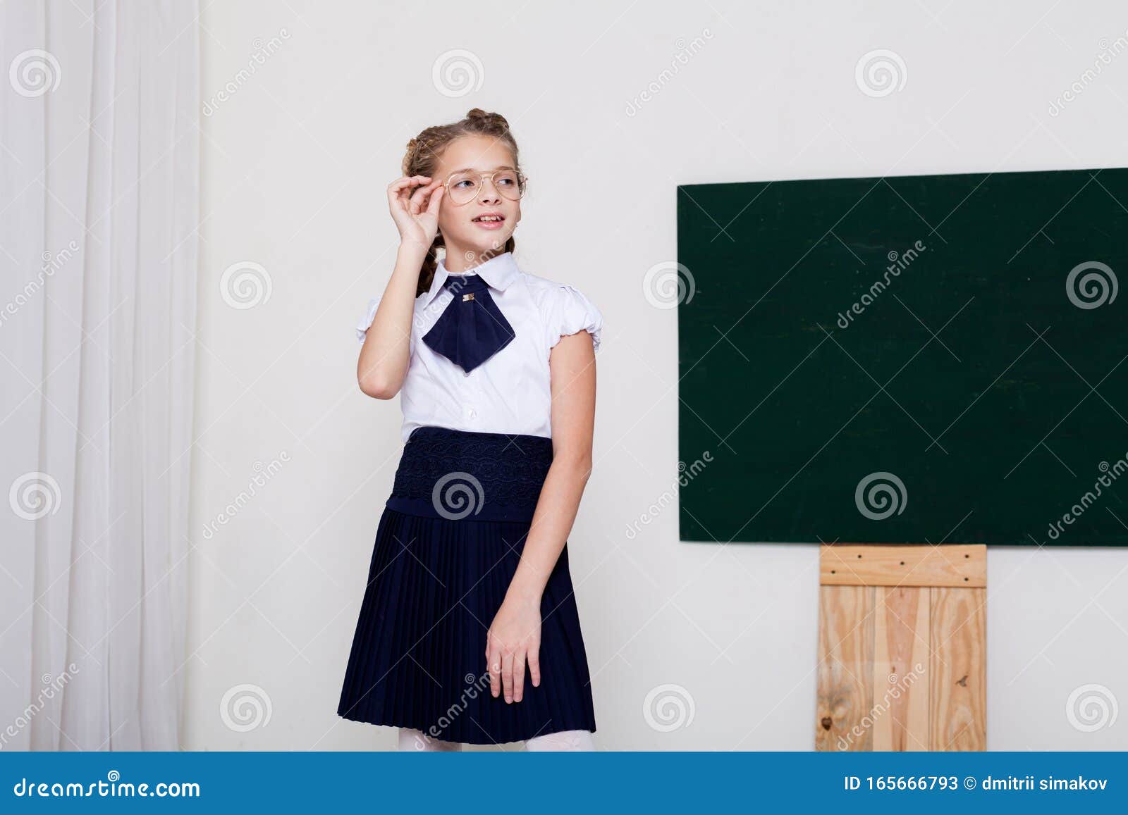 Girl School Study Stands at the Green Board in the Classroom Stock ...