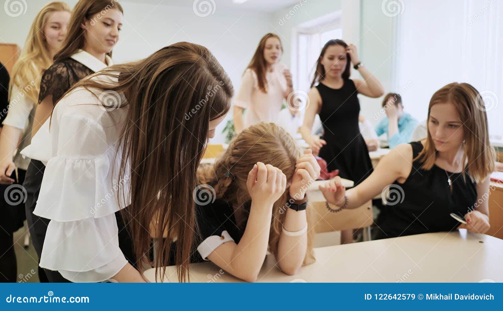 The Girl is a Schoolgirl Crying in Class and Her Classmates Console Her ...