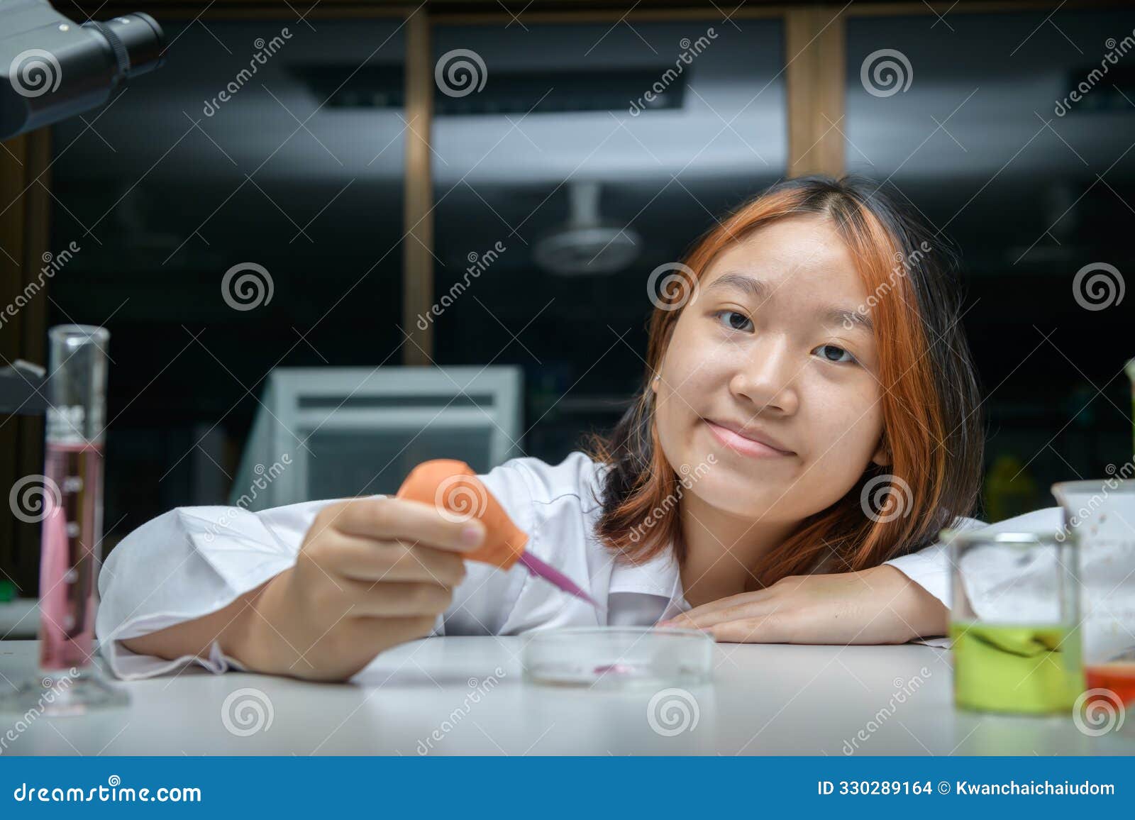 Girl Scientist Using Dropper with Rubber Test. Education and Science ...