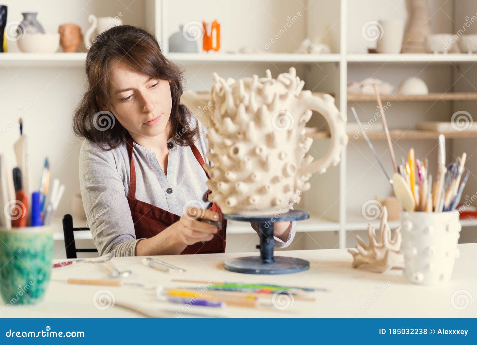 Girl Sculptor in the Workshop Sculpts from Clay Stock Photo - Image of ...