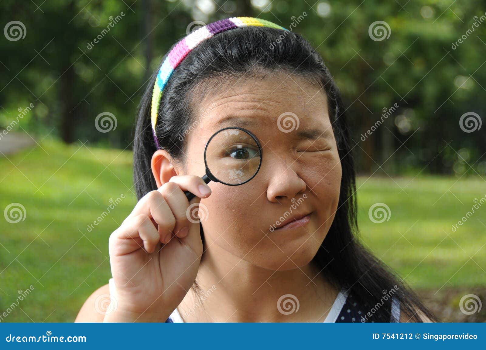 Girl searching for clue stock photo. Image of picnic, park - 7541212